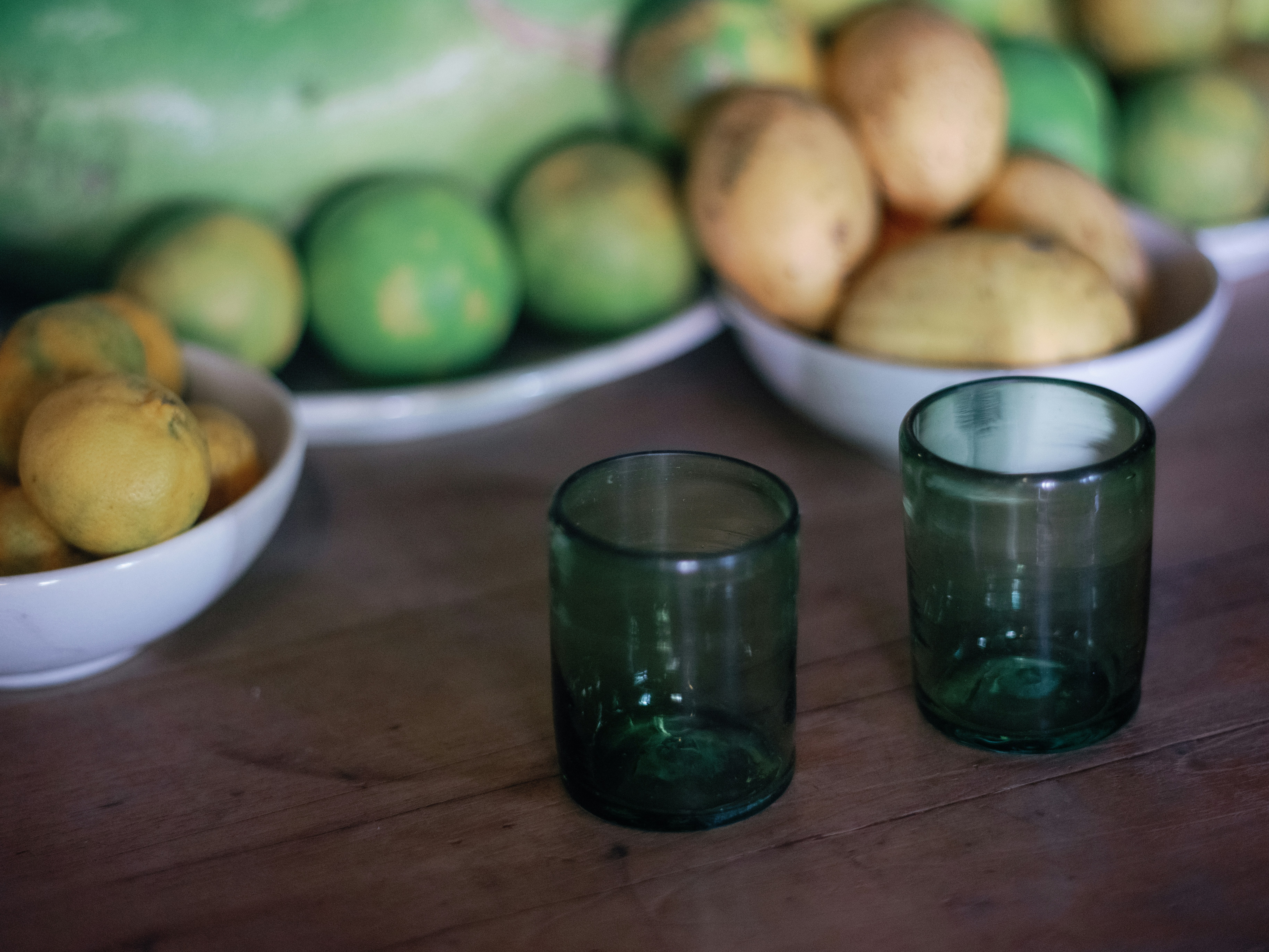 Emerald Tumblers Among Citrus: A Quiet Still-Life
