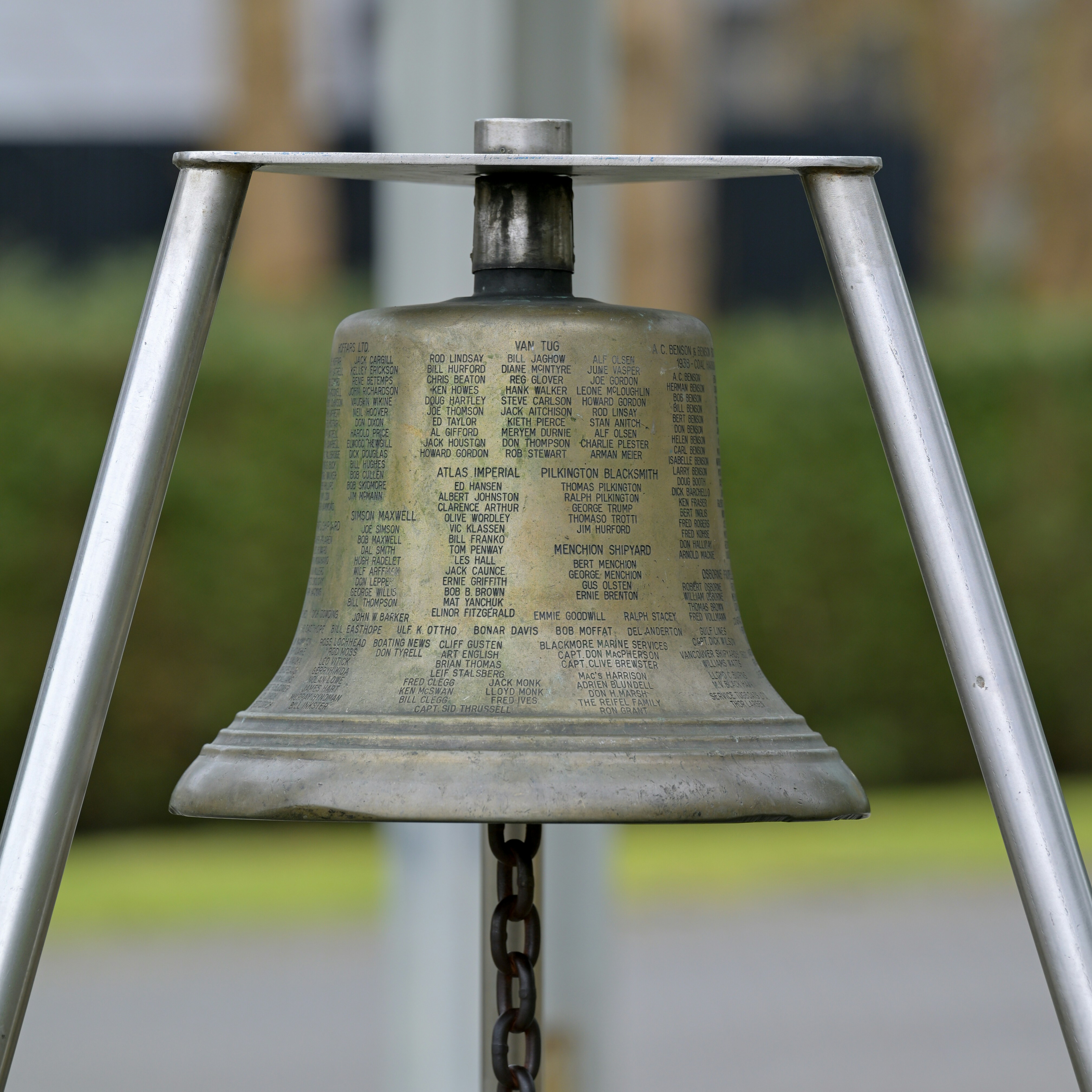 A large bell sitting on top of a metal pole photo – Free Bell Image on ...