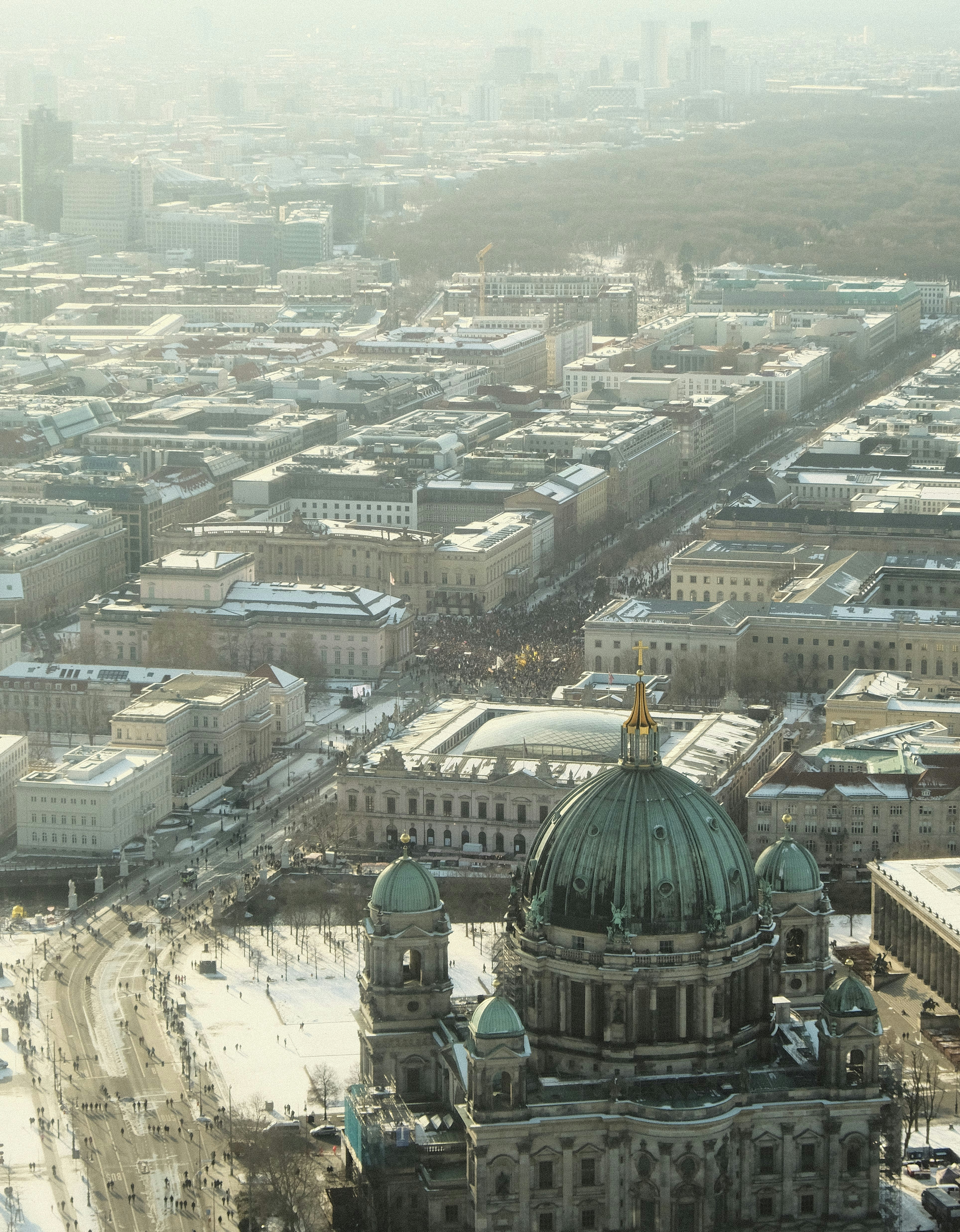 Dawn Over Berlin Cathedral: Aerial View of a Snow-Blanketed City
