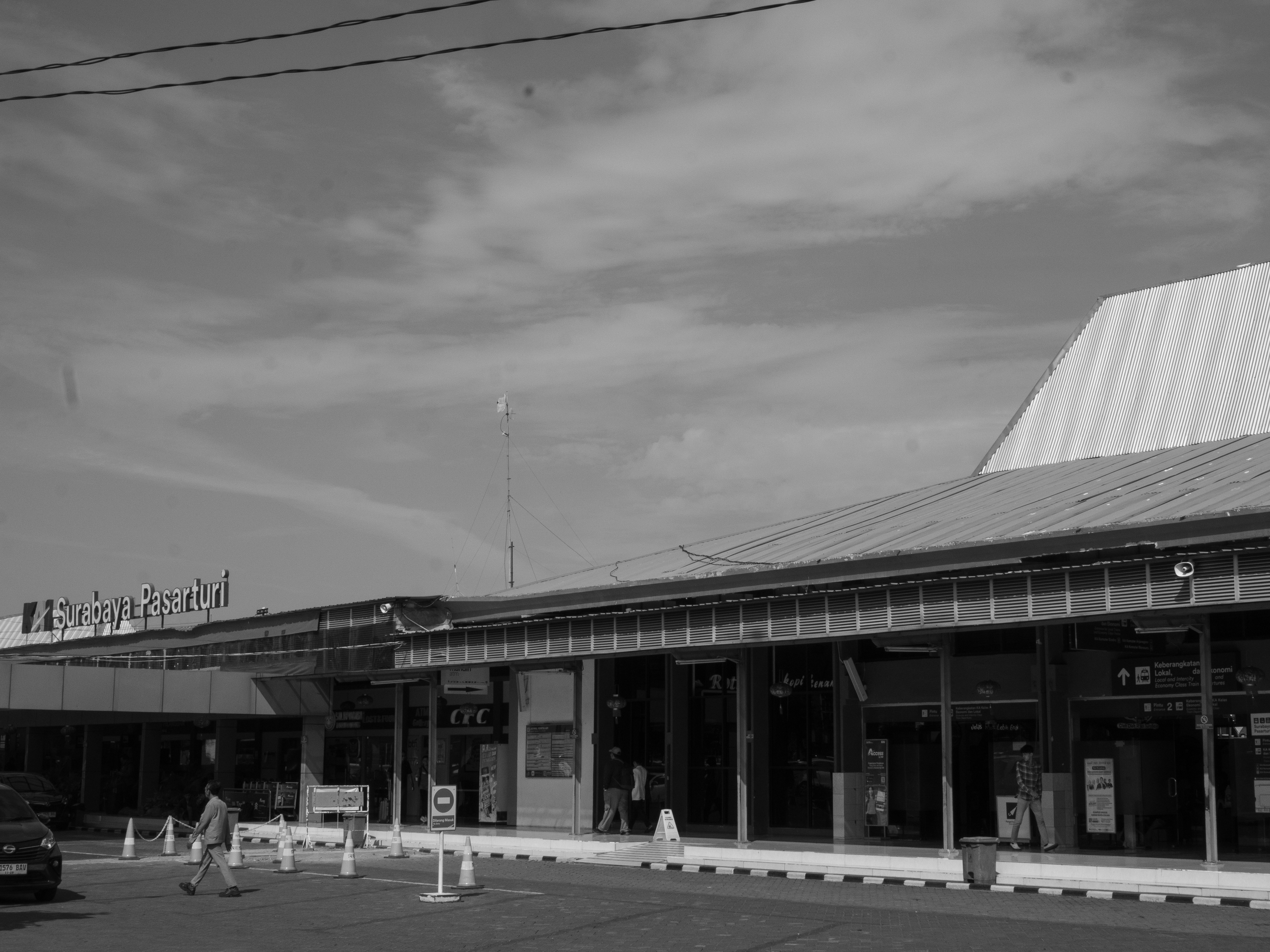 Monochrome Platform Pulse: Quiet Suburban Station Scene