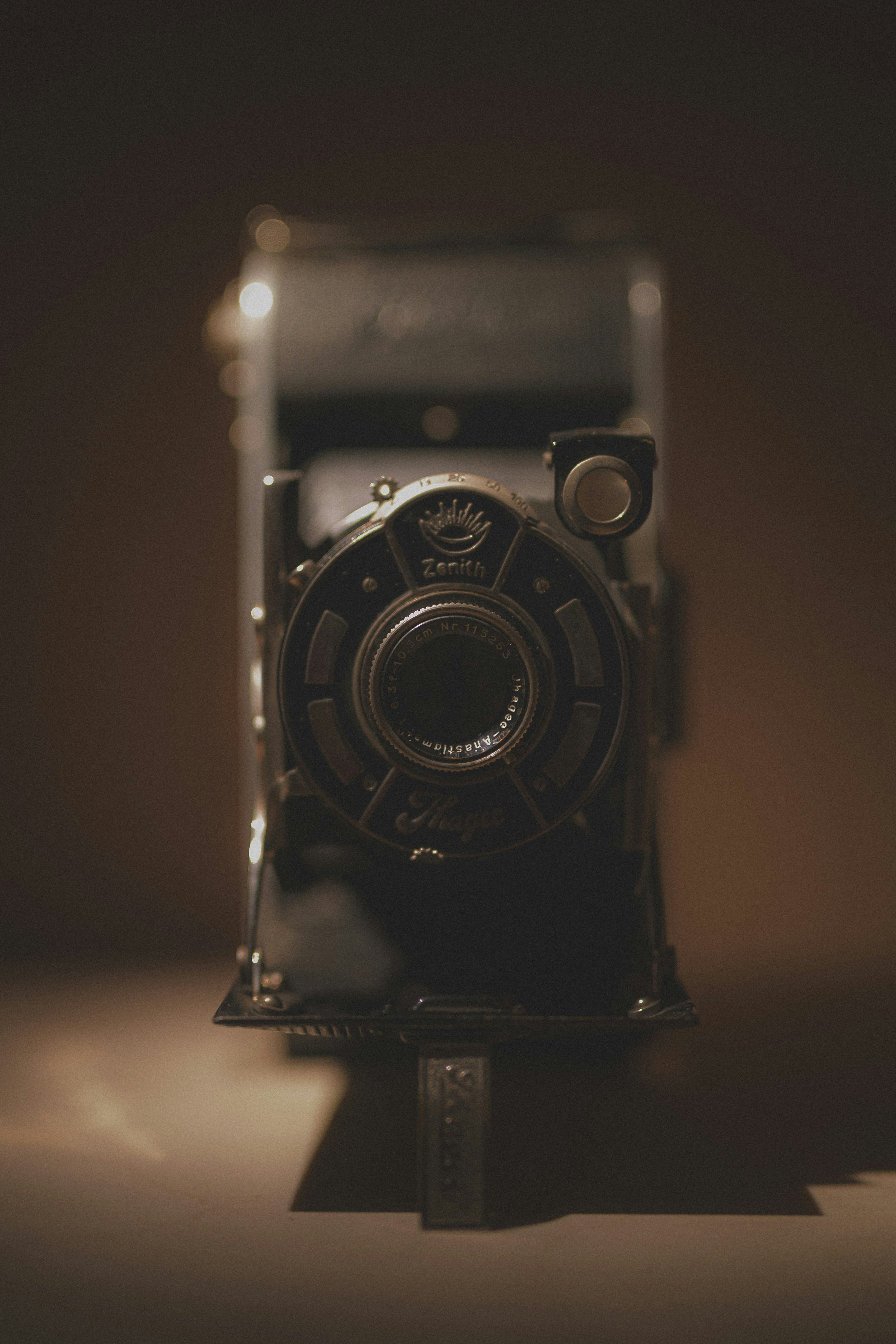 Vintage Zenith camera positioned against a softly lit backdrop, emphasizing its intricate design and elegance.