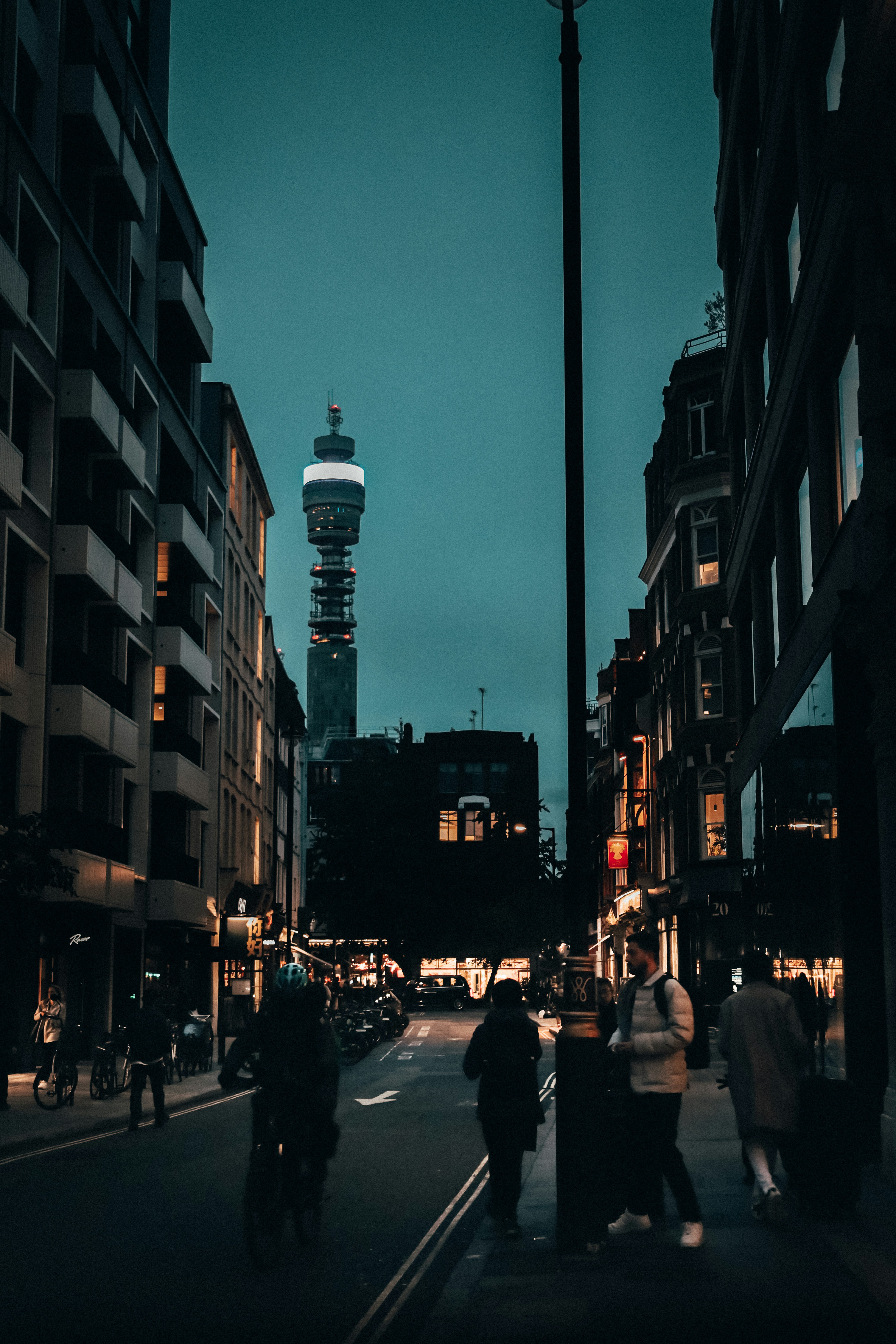 Urban Cathedral at Dusk: Night Market Beneath a Towering Skyline