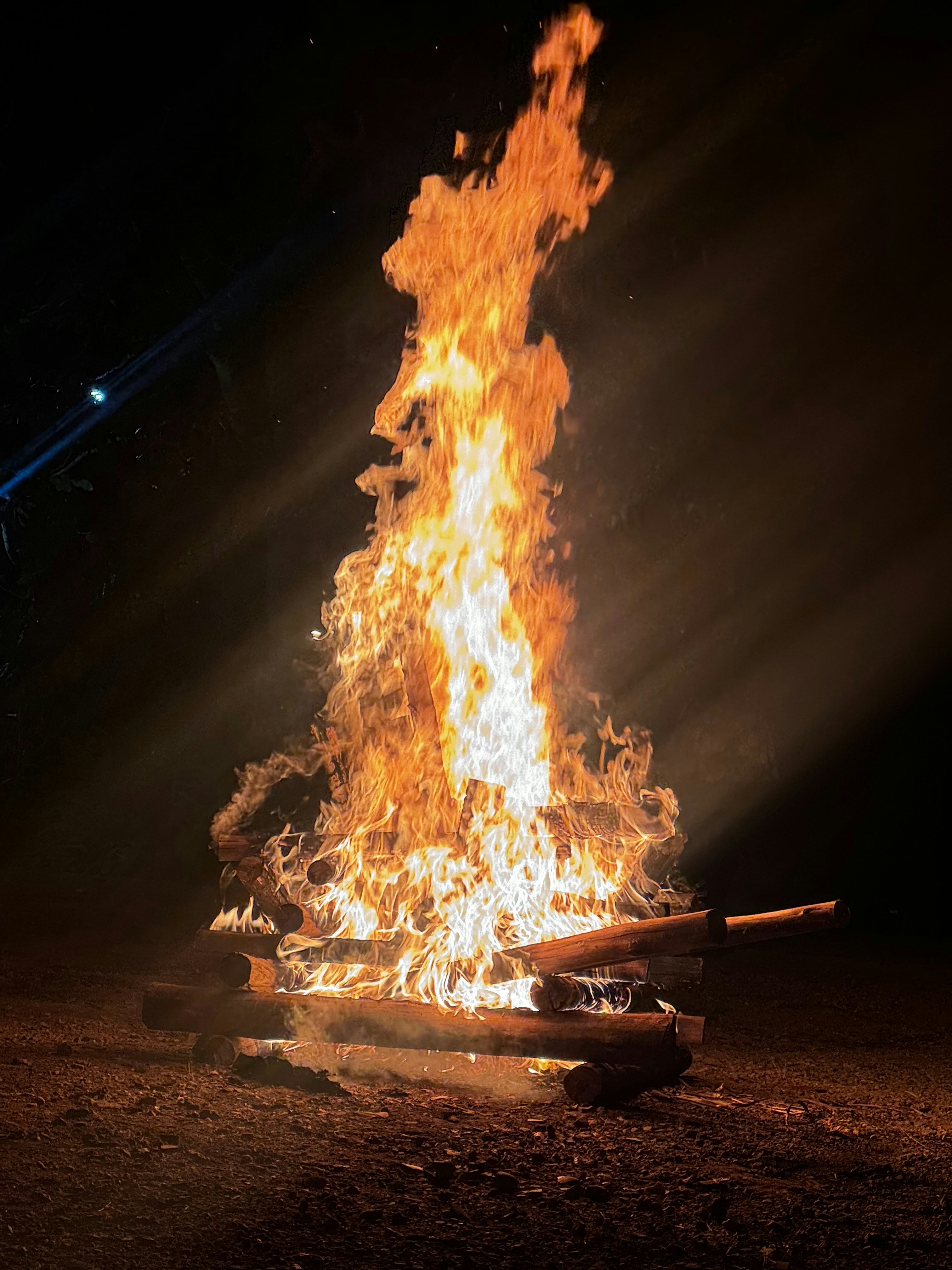 Ember Cathedral at Midnight: A Lone Bonfire Illuminates the Ground