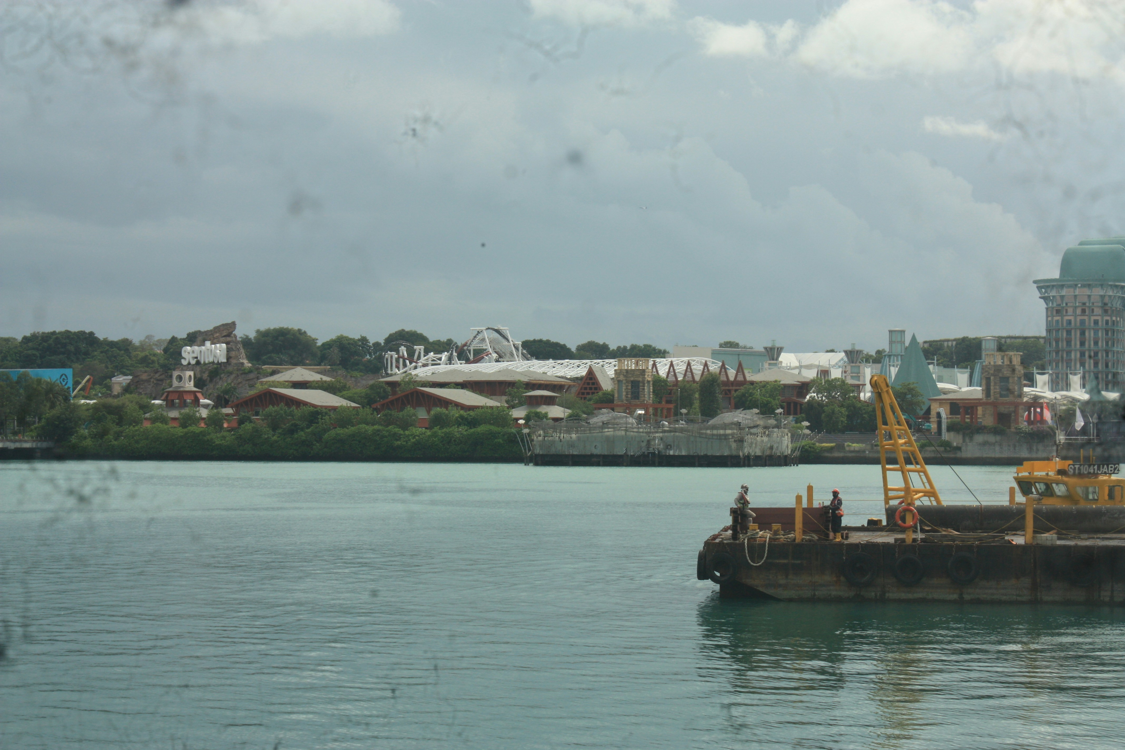 A large barge floating on top of a large body of water photo – Free ...