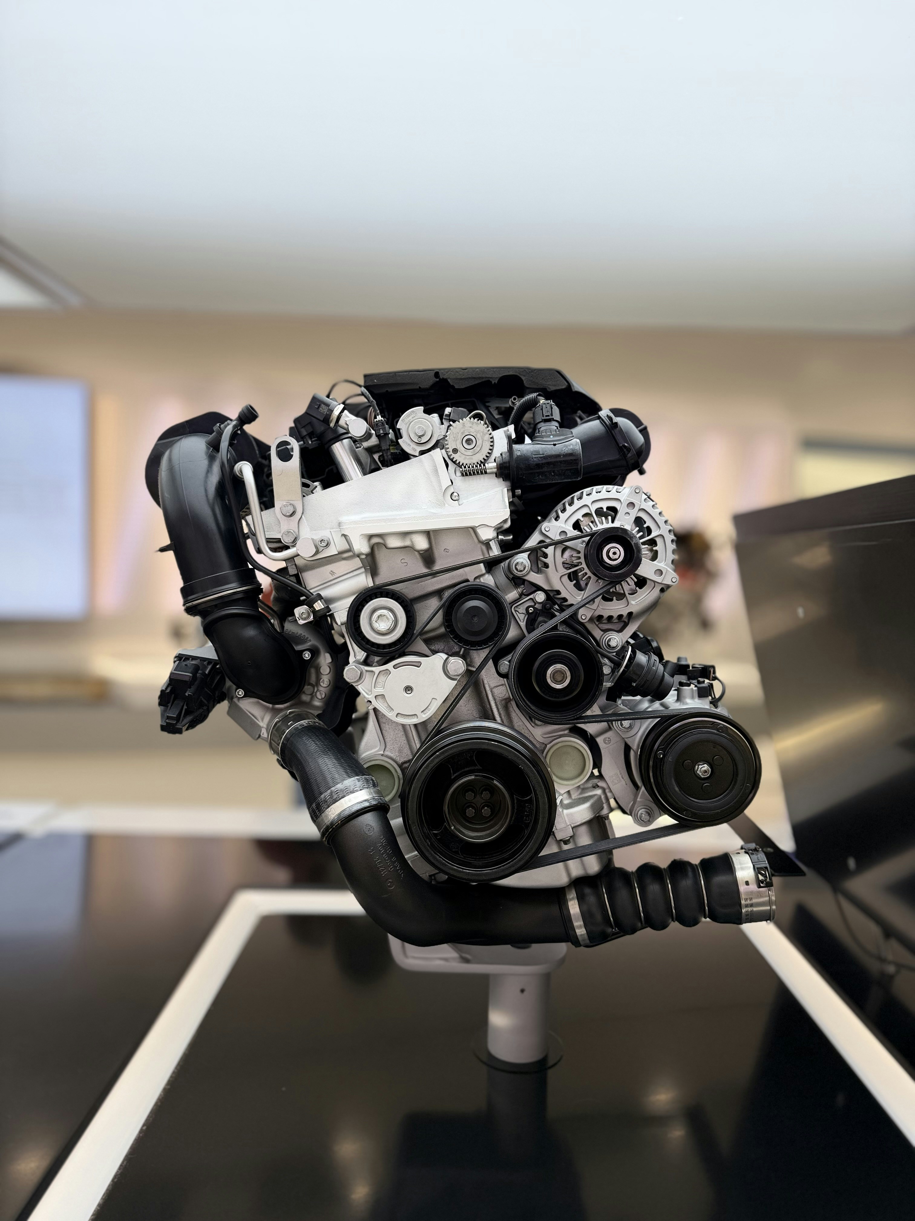 A car engine on display in a showroom photo – Free Machine Image on ...