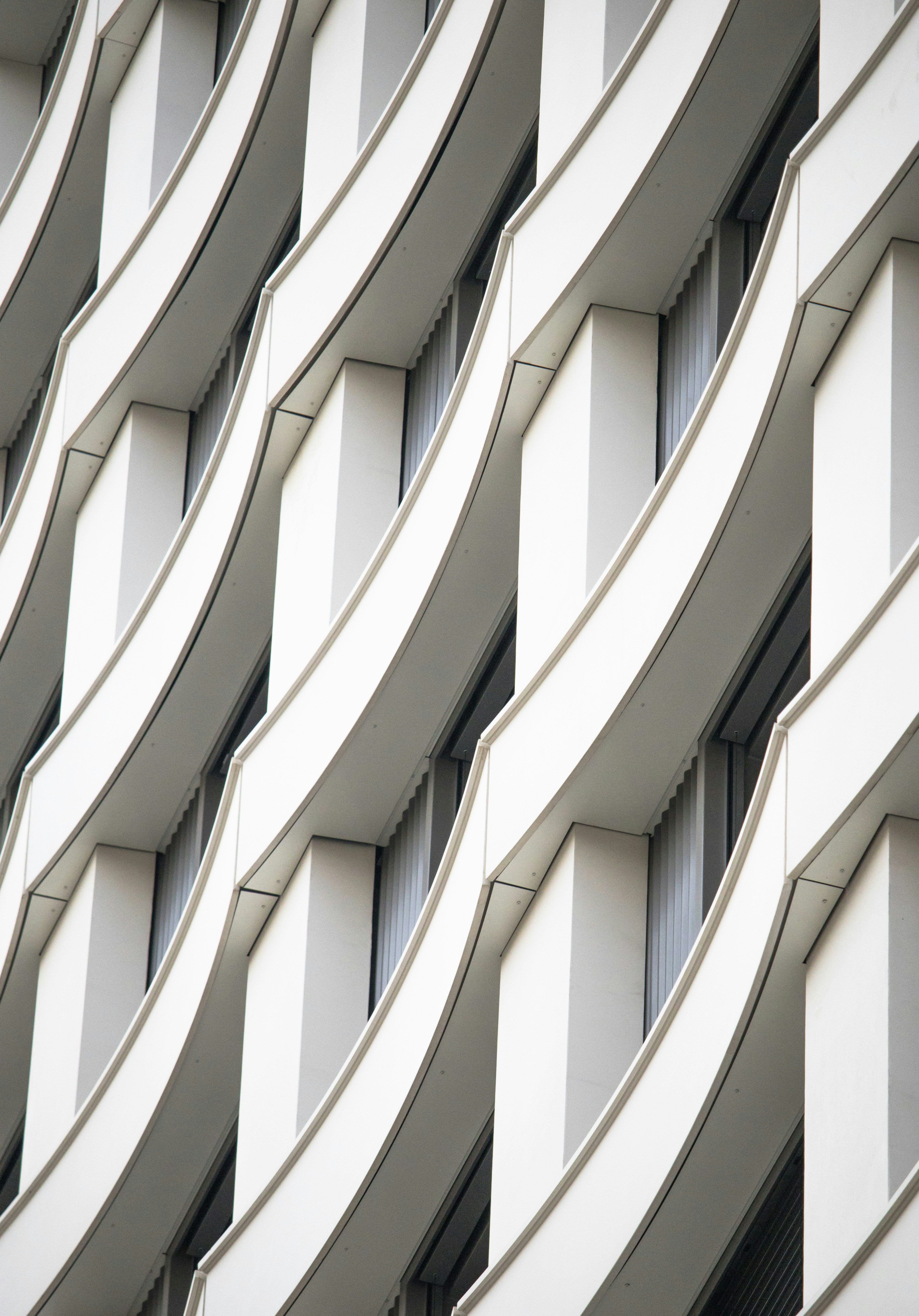 A close up of a building with a lot of windows photo – Free Abstract ...