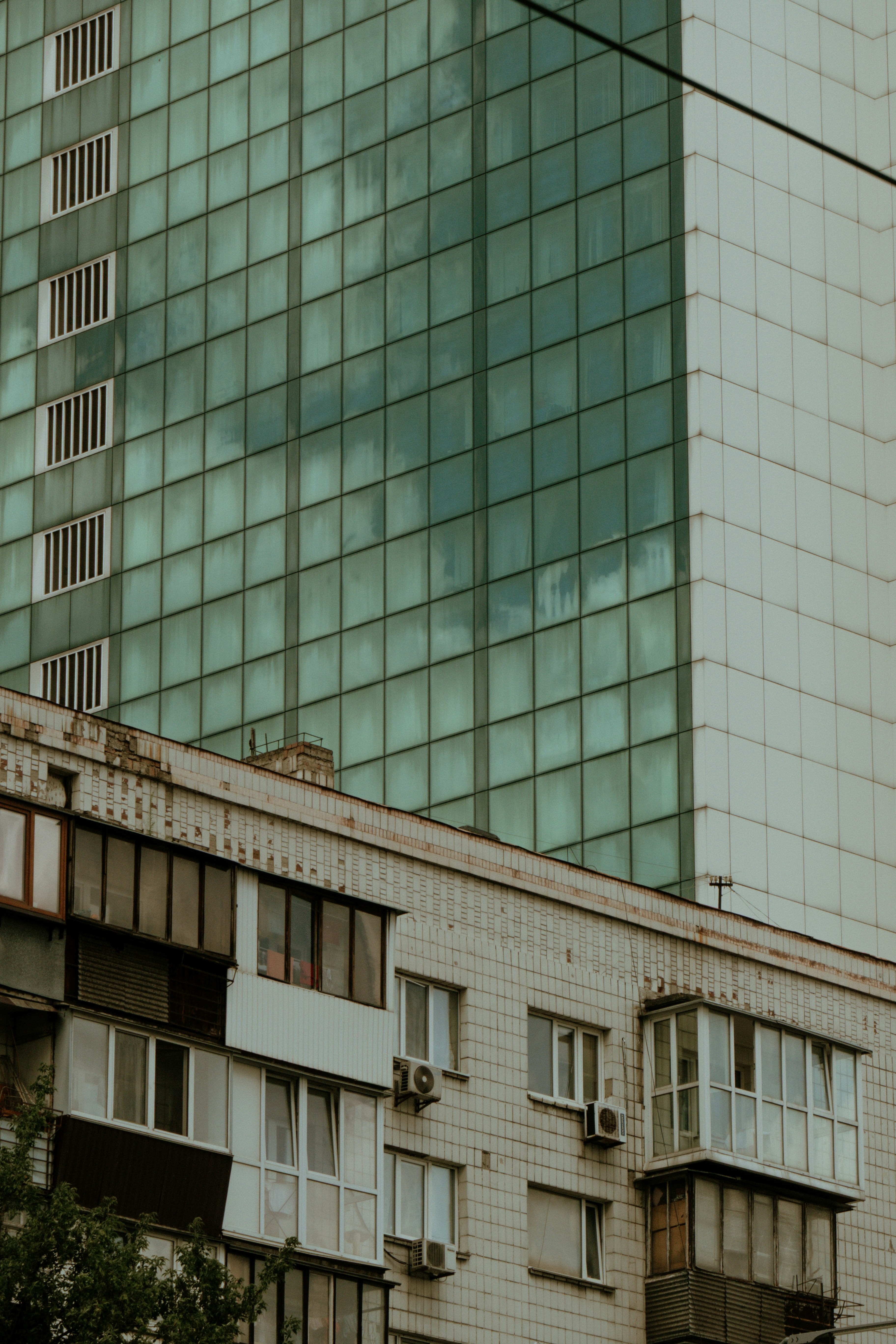 A stop sign in front of a tall building photo – Free Building Image on ...