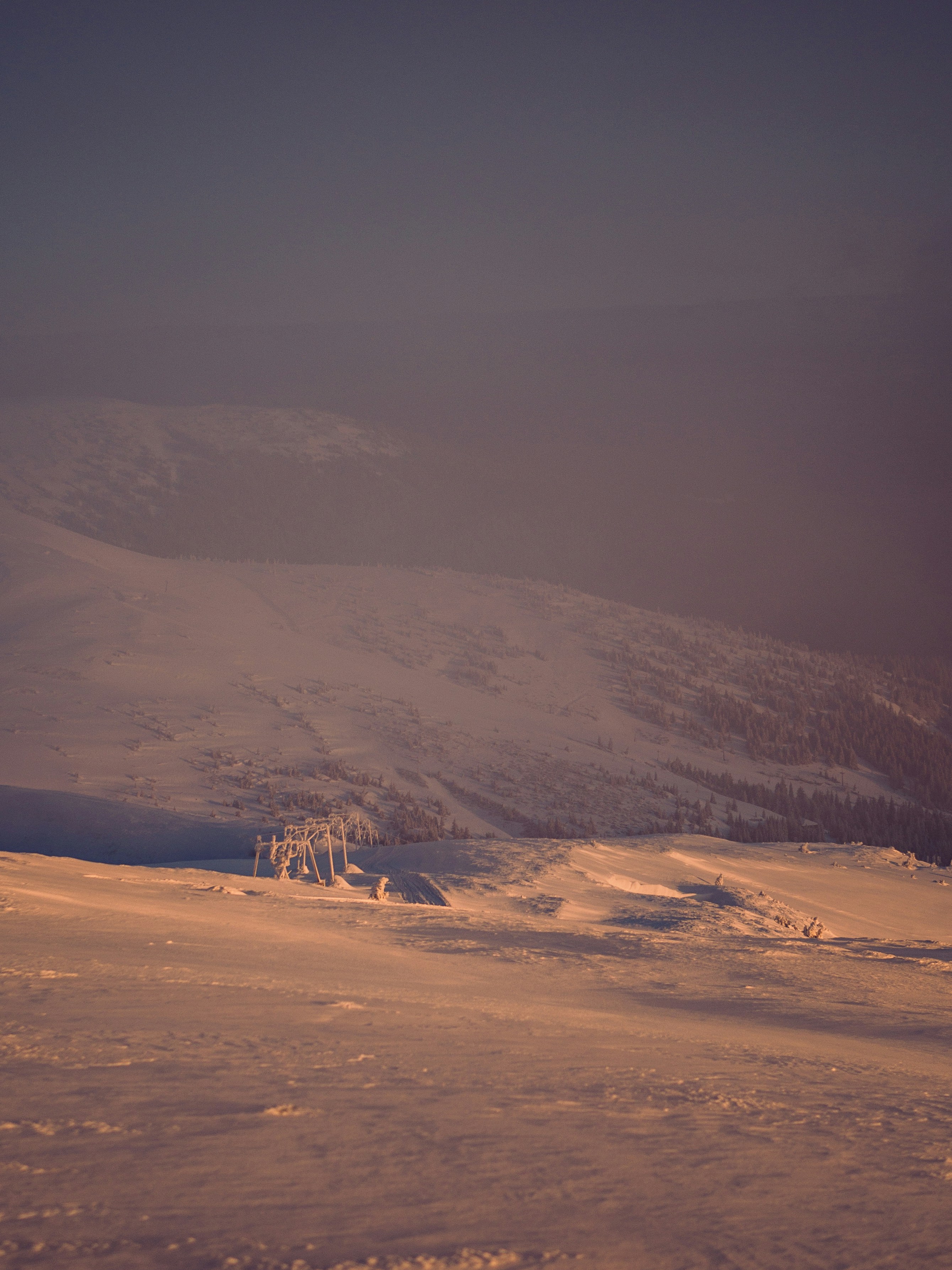 Pastel Dusk Over a Snowbound Basin with a Silent Ski Lift