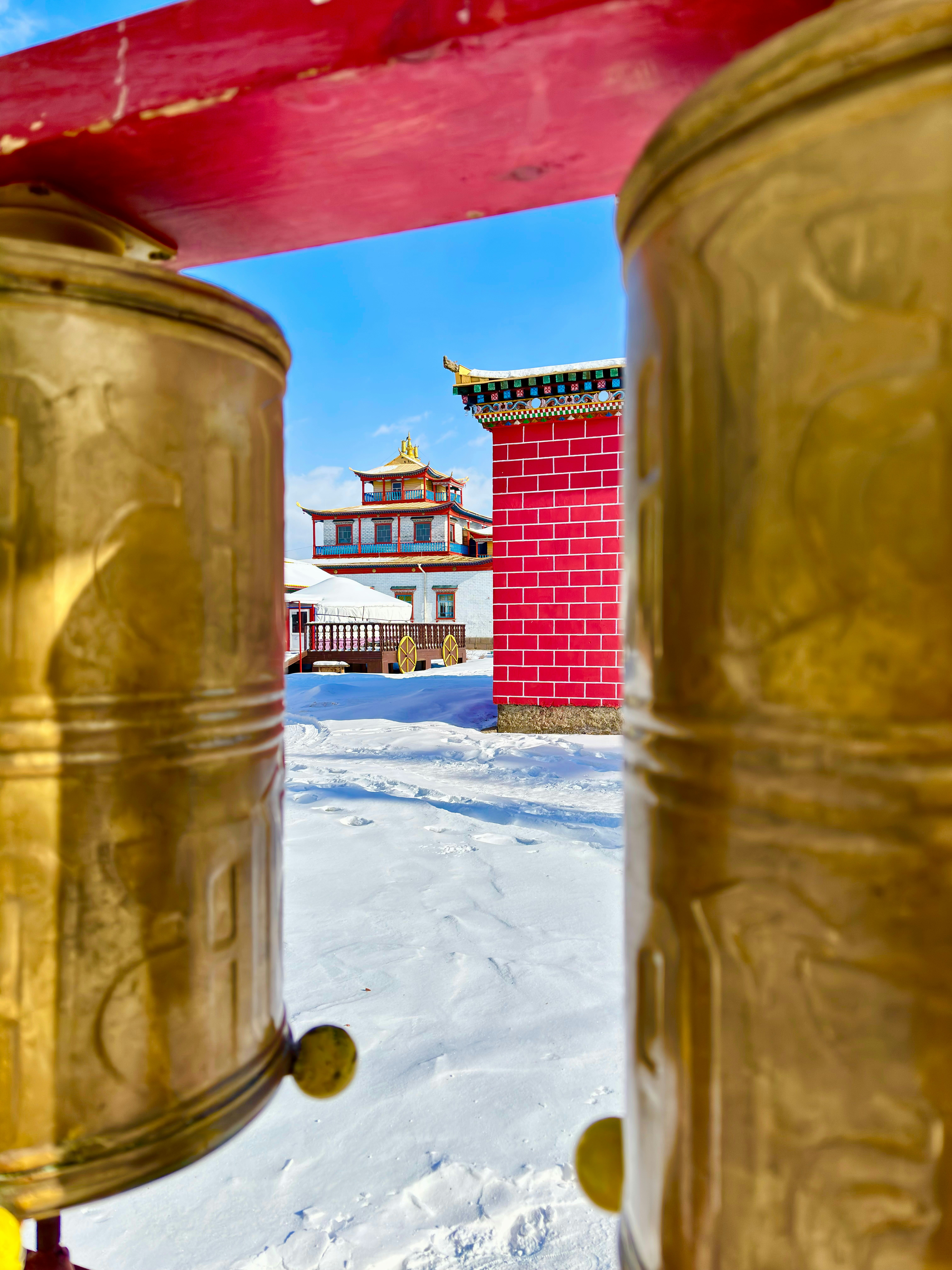 Through Bronze Gates to a Snowy Temple with Golden Roofs