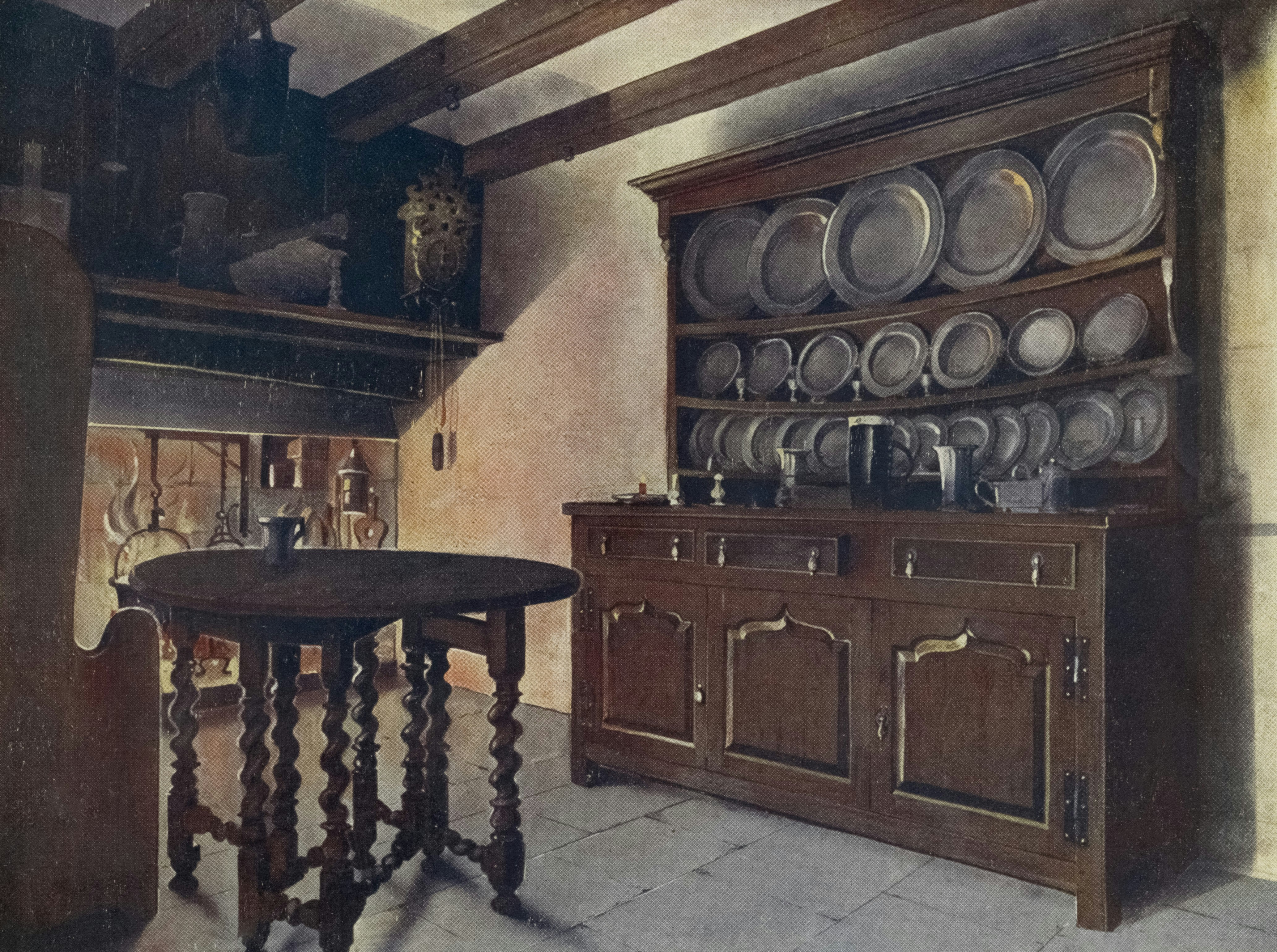 An old fashioned kitchen with a table and cupboards photo – Free ...