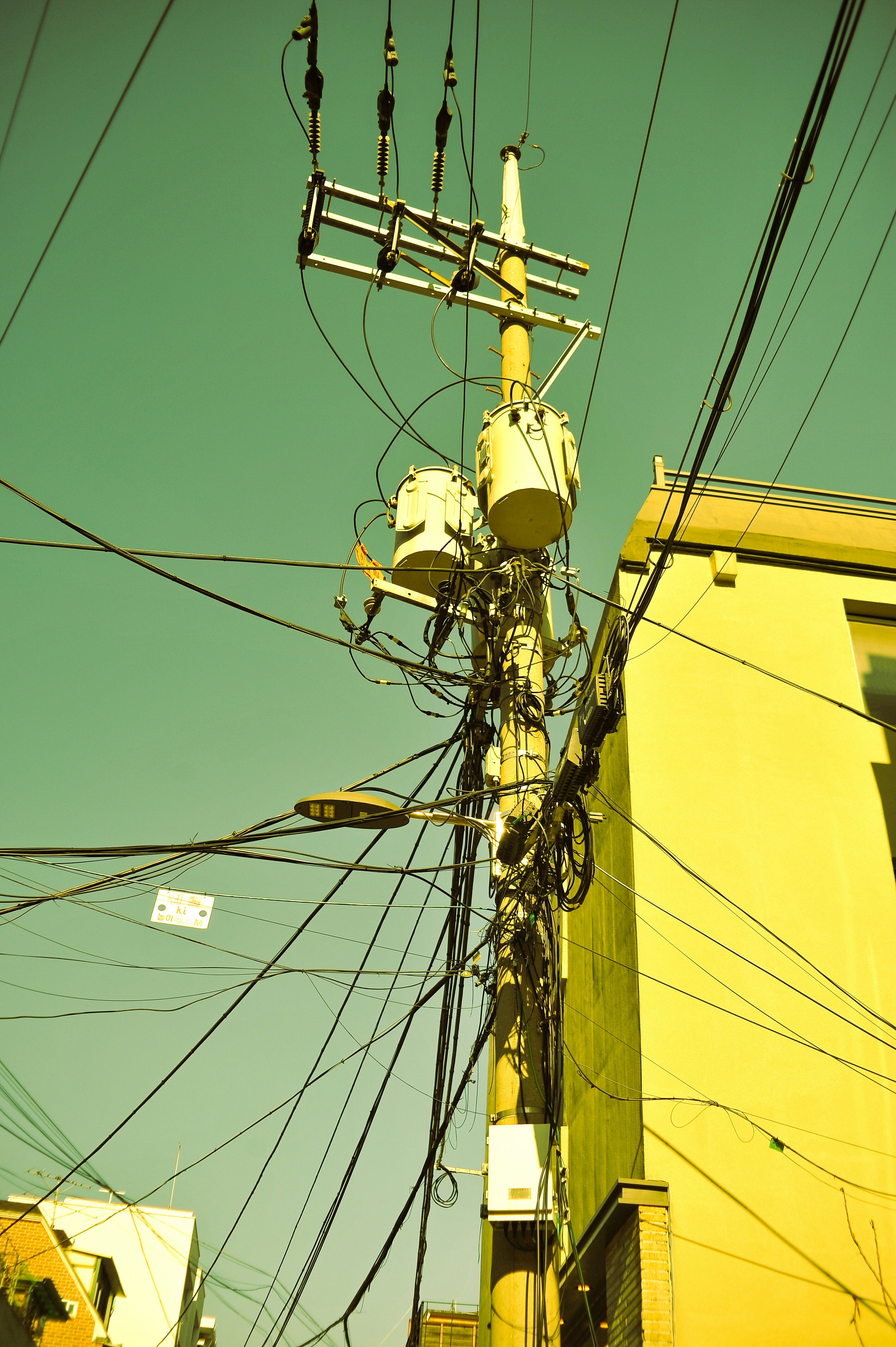 A telephone pole with a lot of wires on it photo – Free 대한민국 서울 Image ...