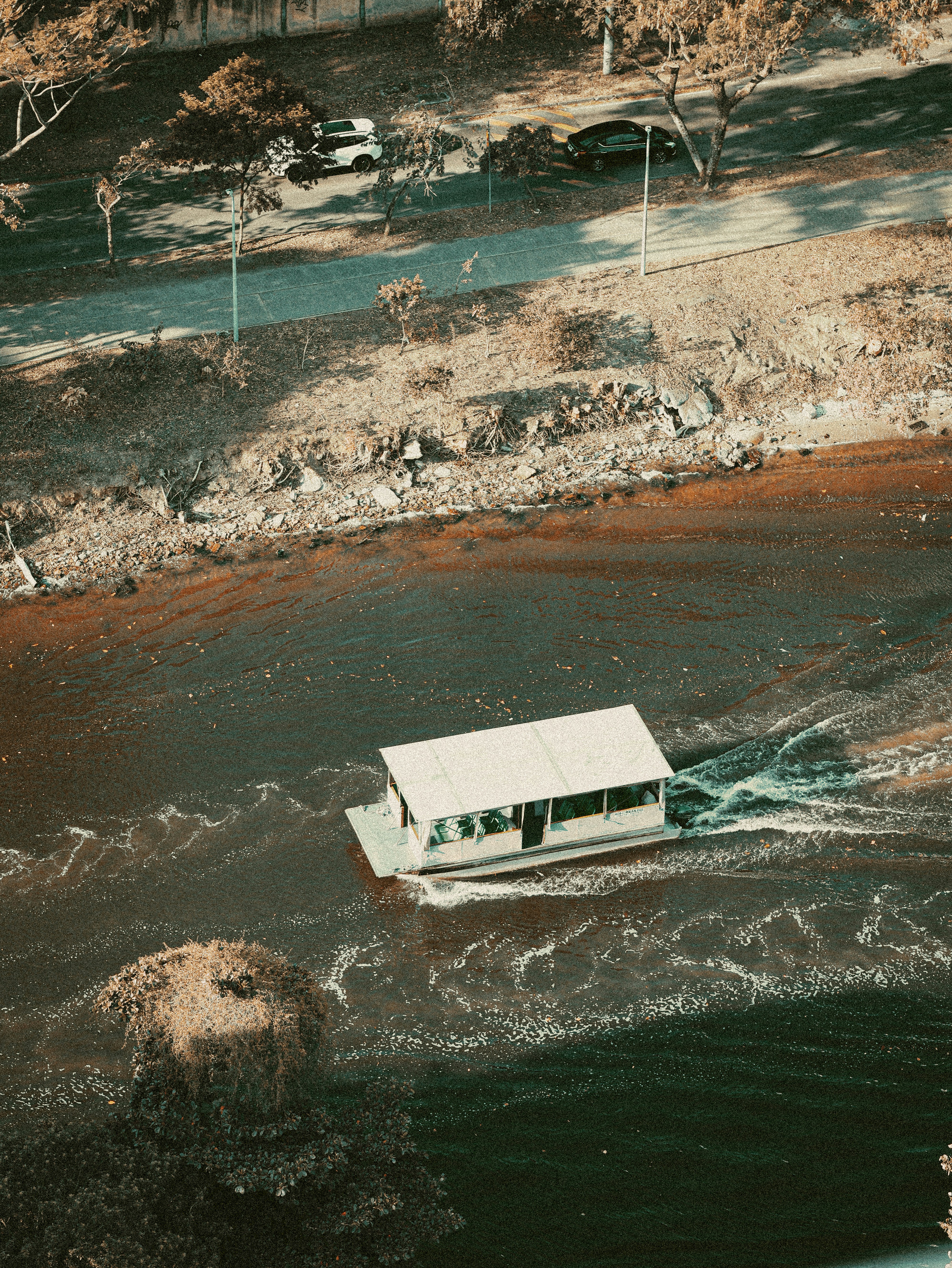 Serene Aerial Voyage: A Boat's Journey