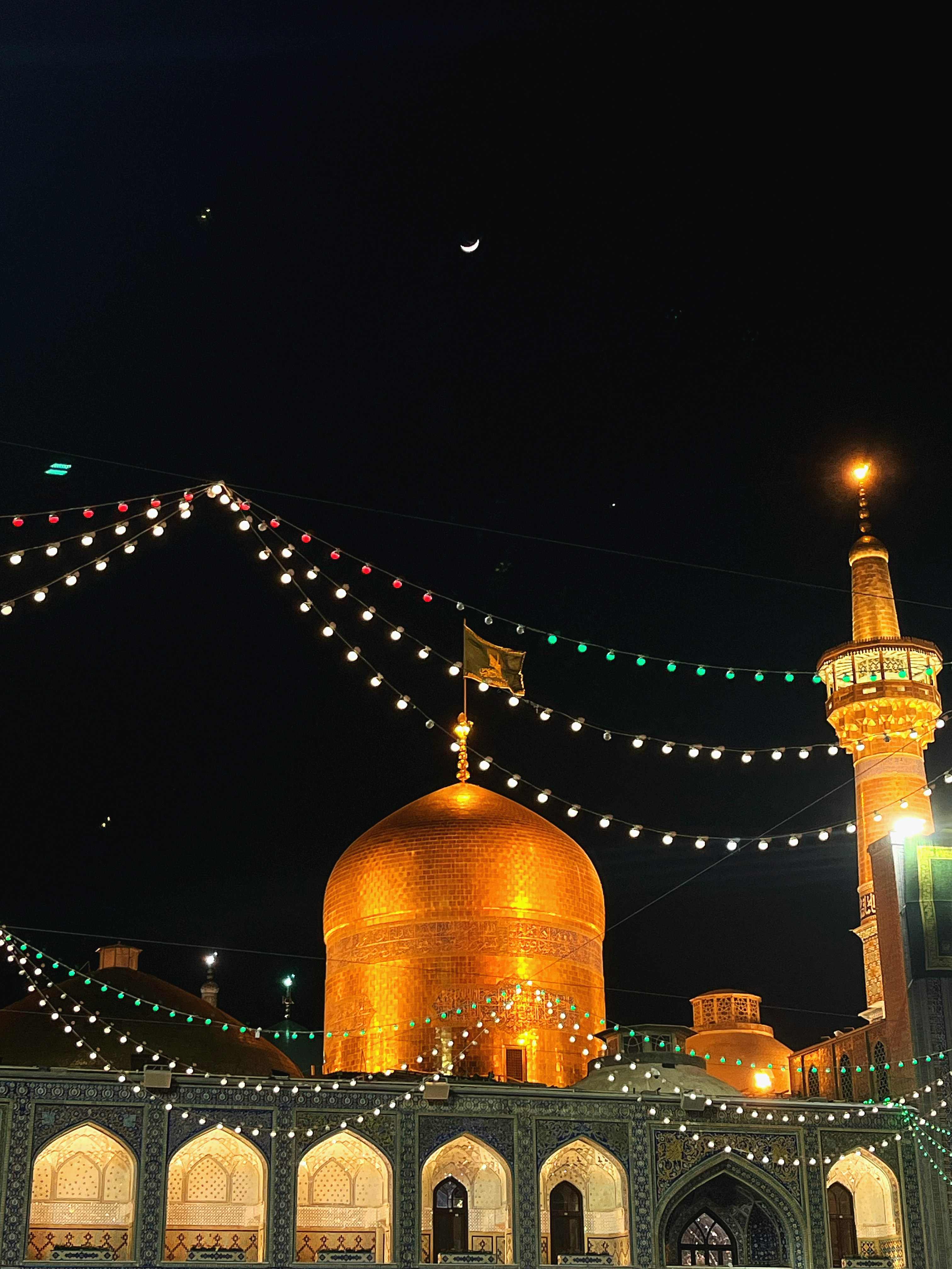 Nocturnal Lanterns Draped Over a Golden-Domed Mosque
