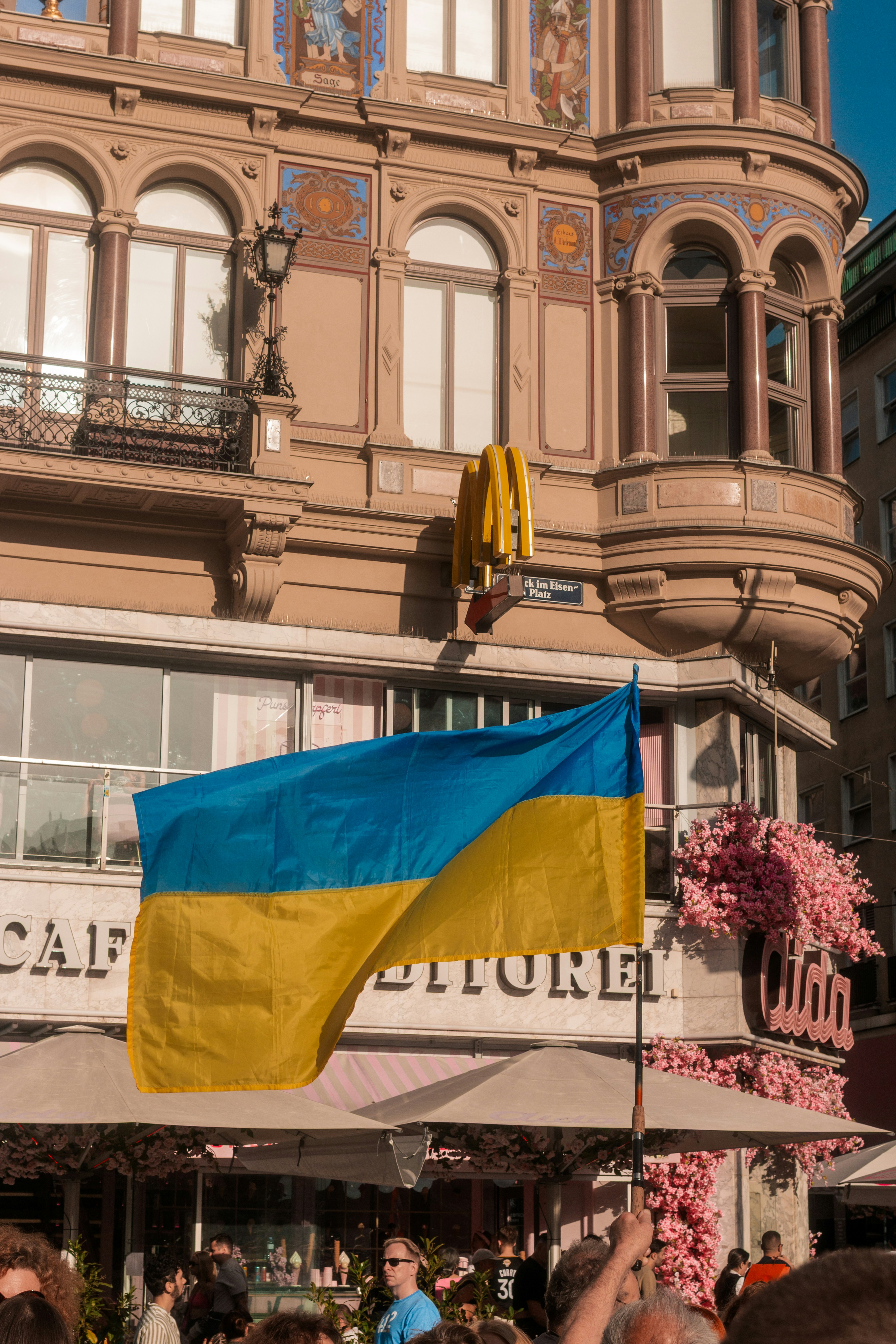 City Flag Portrait: Ukrainian Banner in Front of a Victorian Bakery