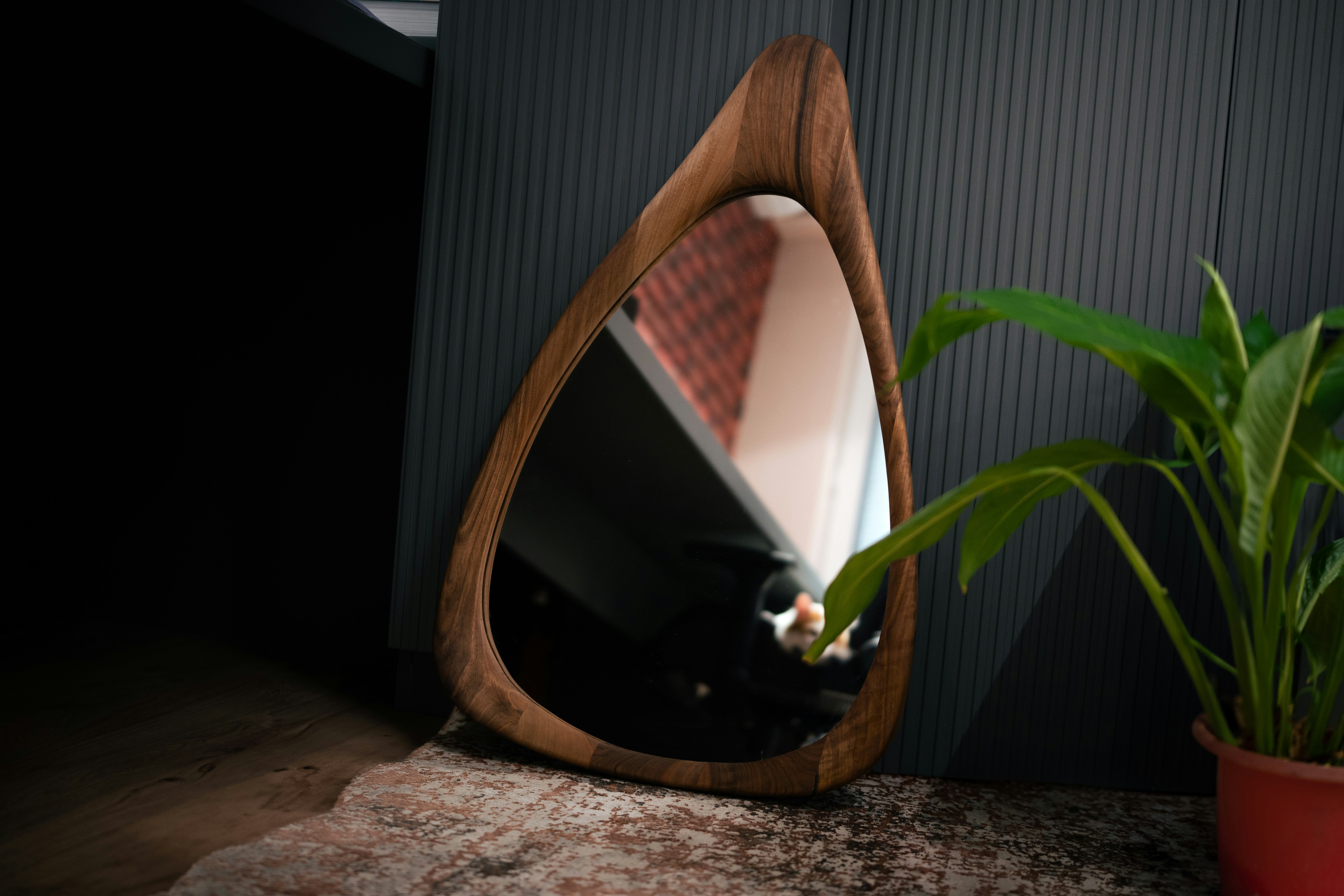 Walnut Teardrop Mirror in a Moody Corner
