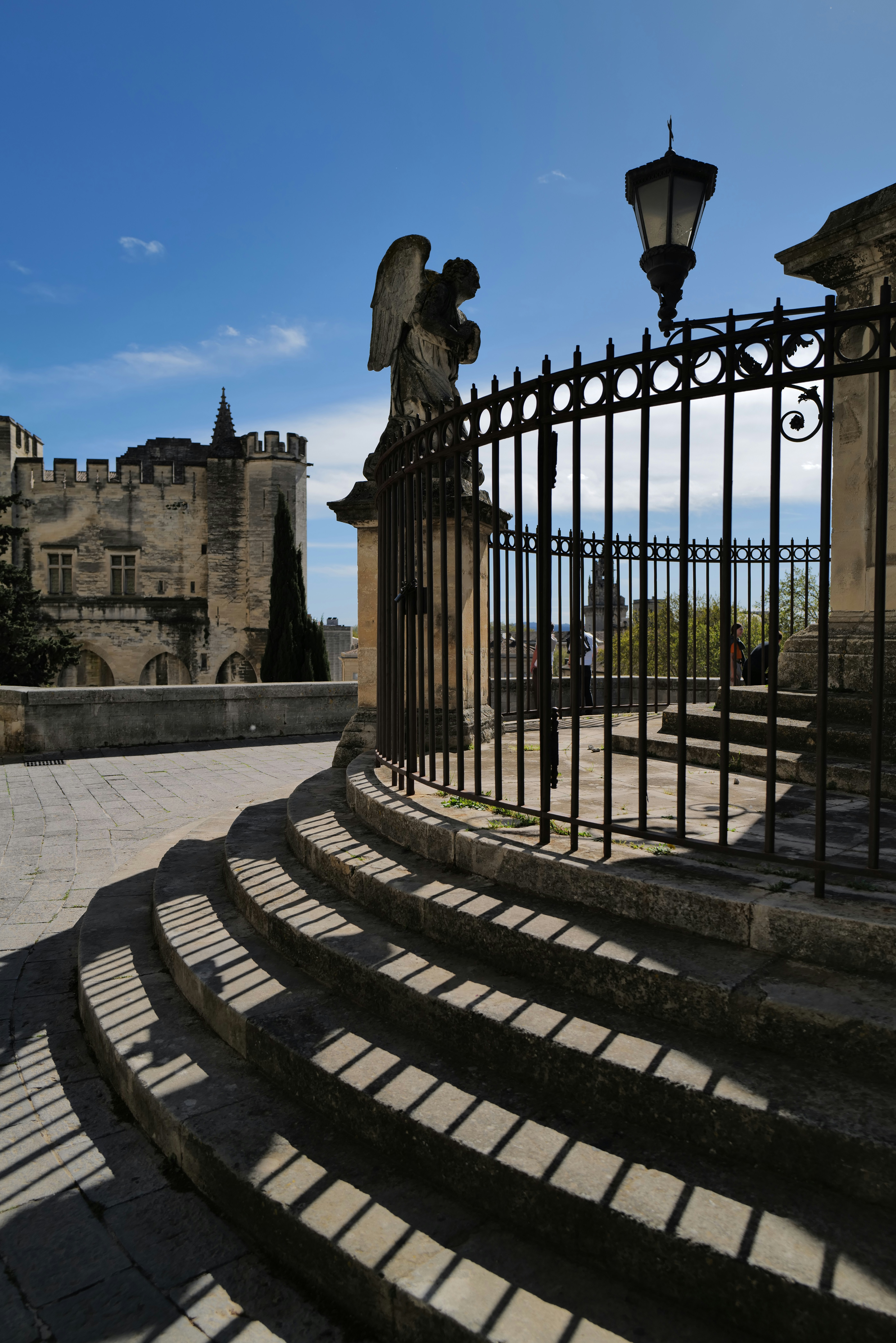 A wrought iron fence and steps leading to a castle photo – Free Gate ...