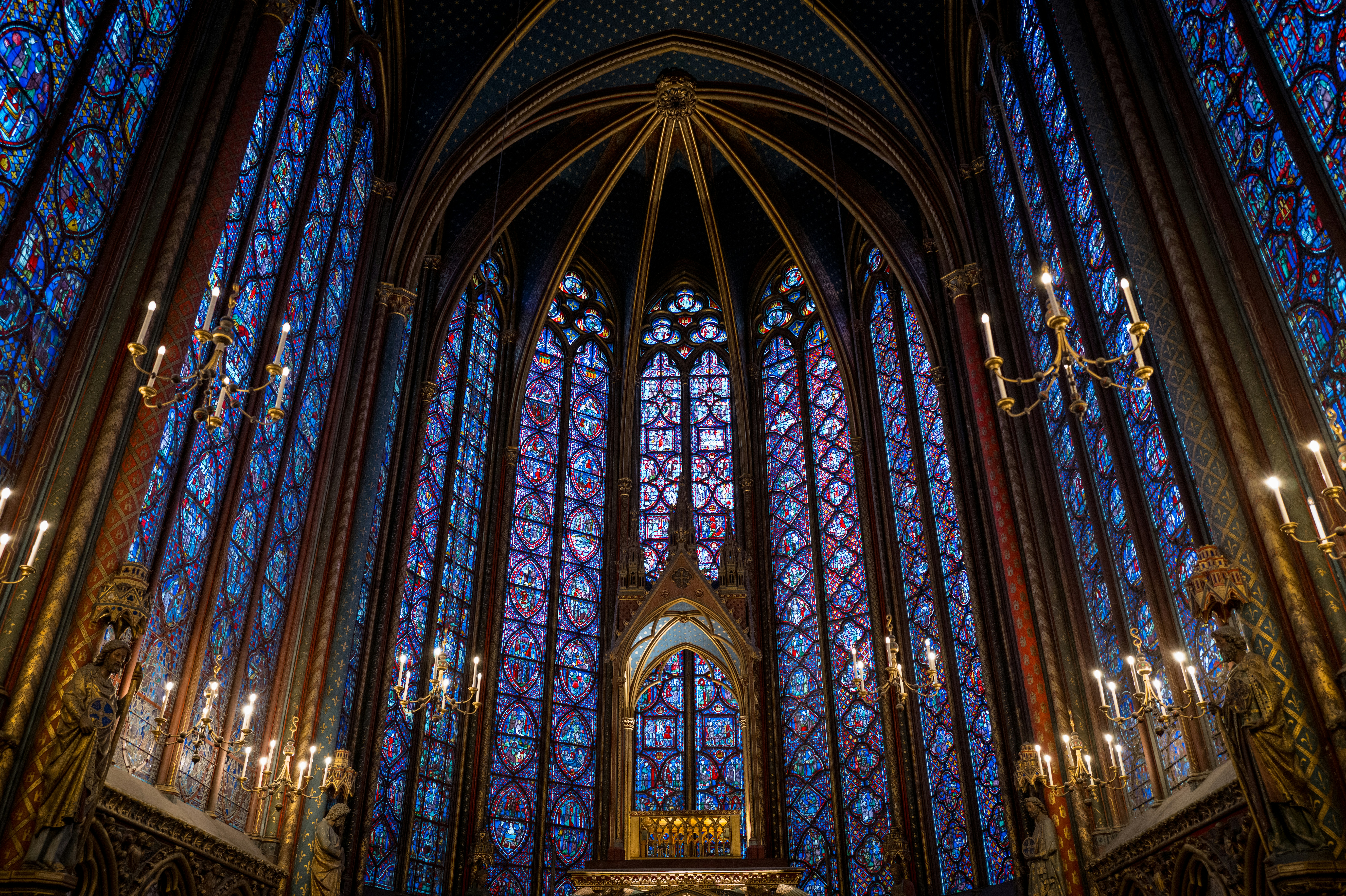 A large cathedral with stained glass windows and chandeliers photo ...