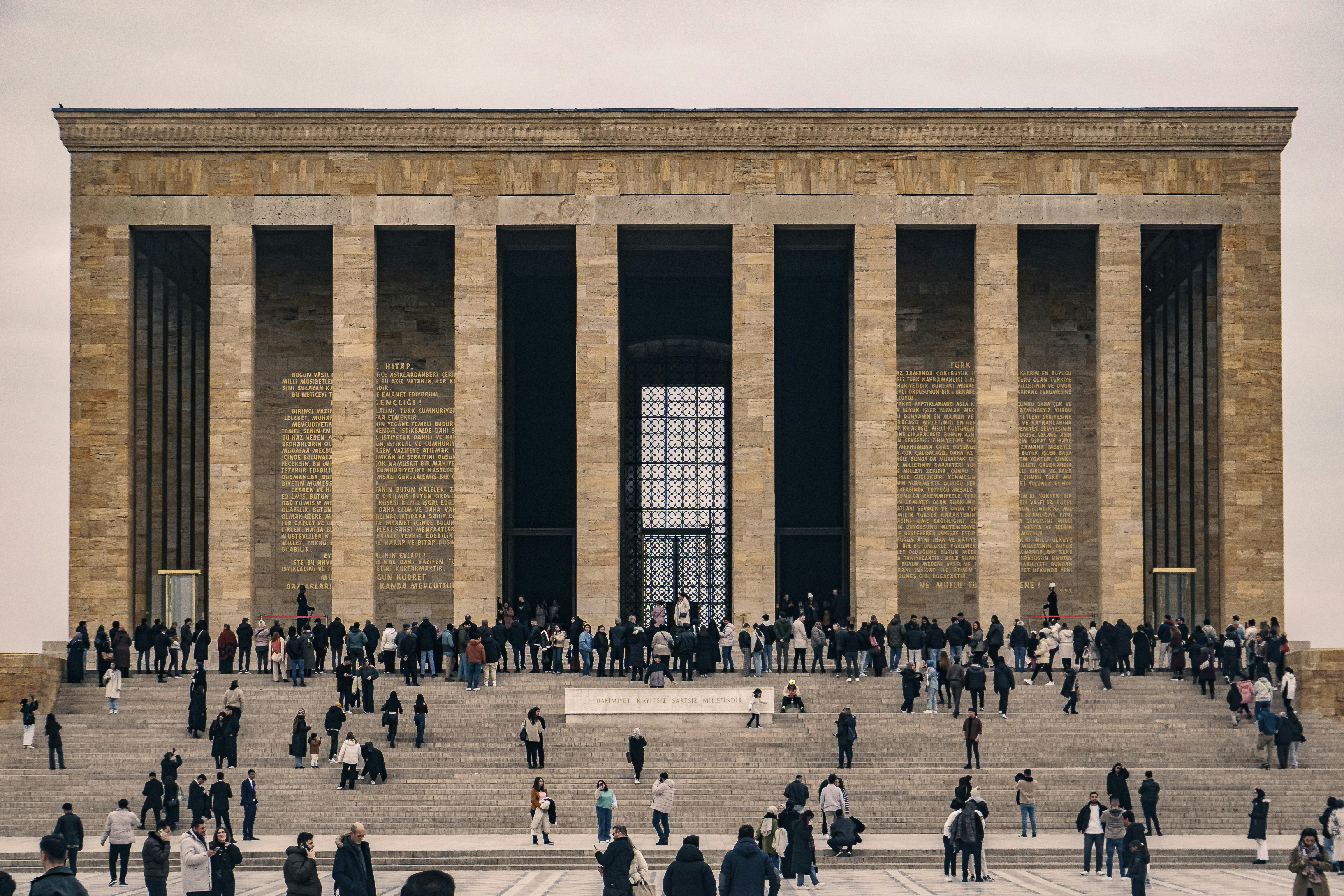 A group of people standing in front of a building photo – Free Building ...