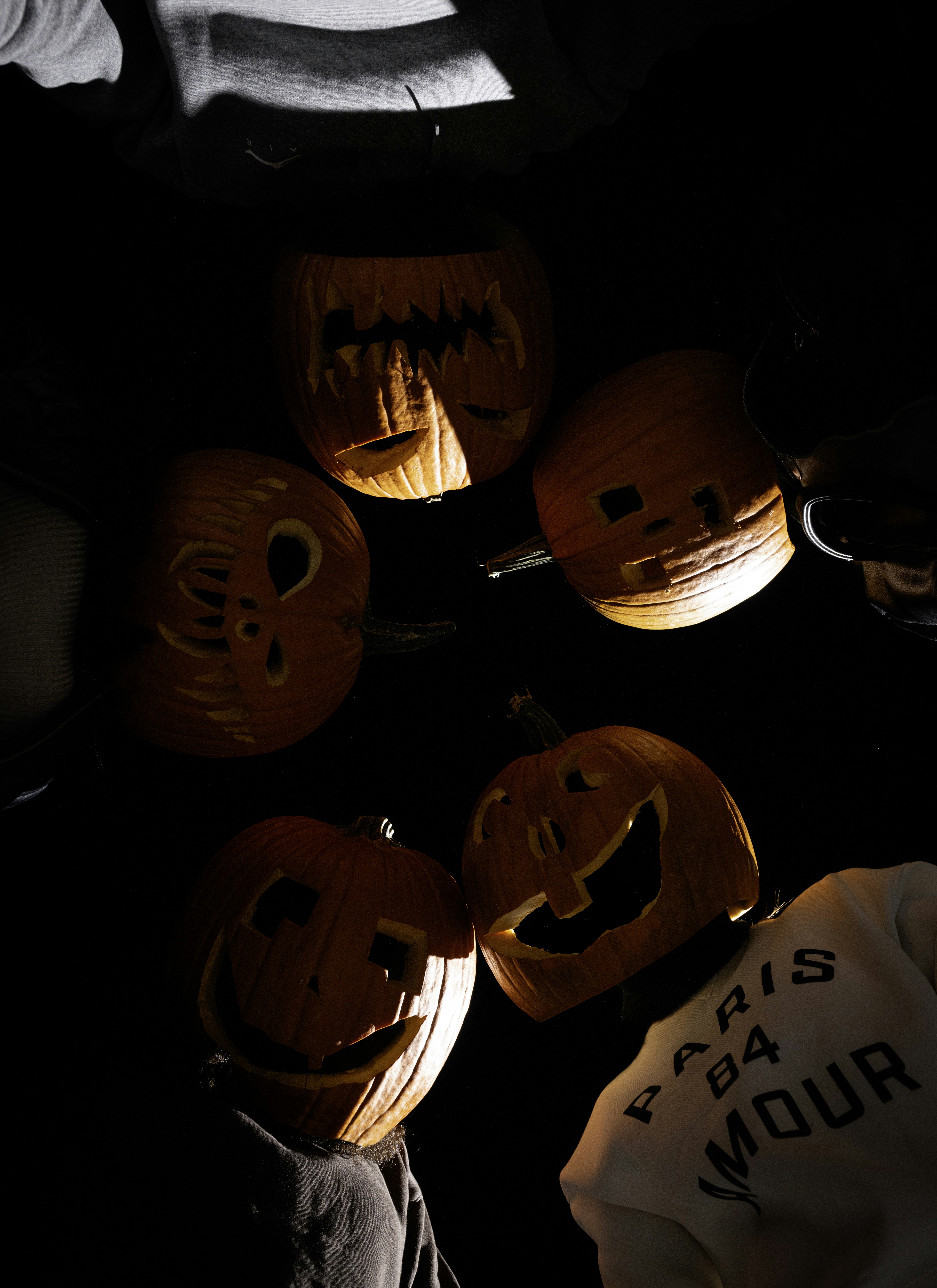 A group of pumpkins with faces carved into them
