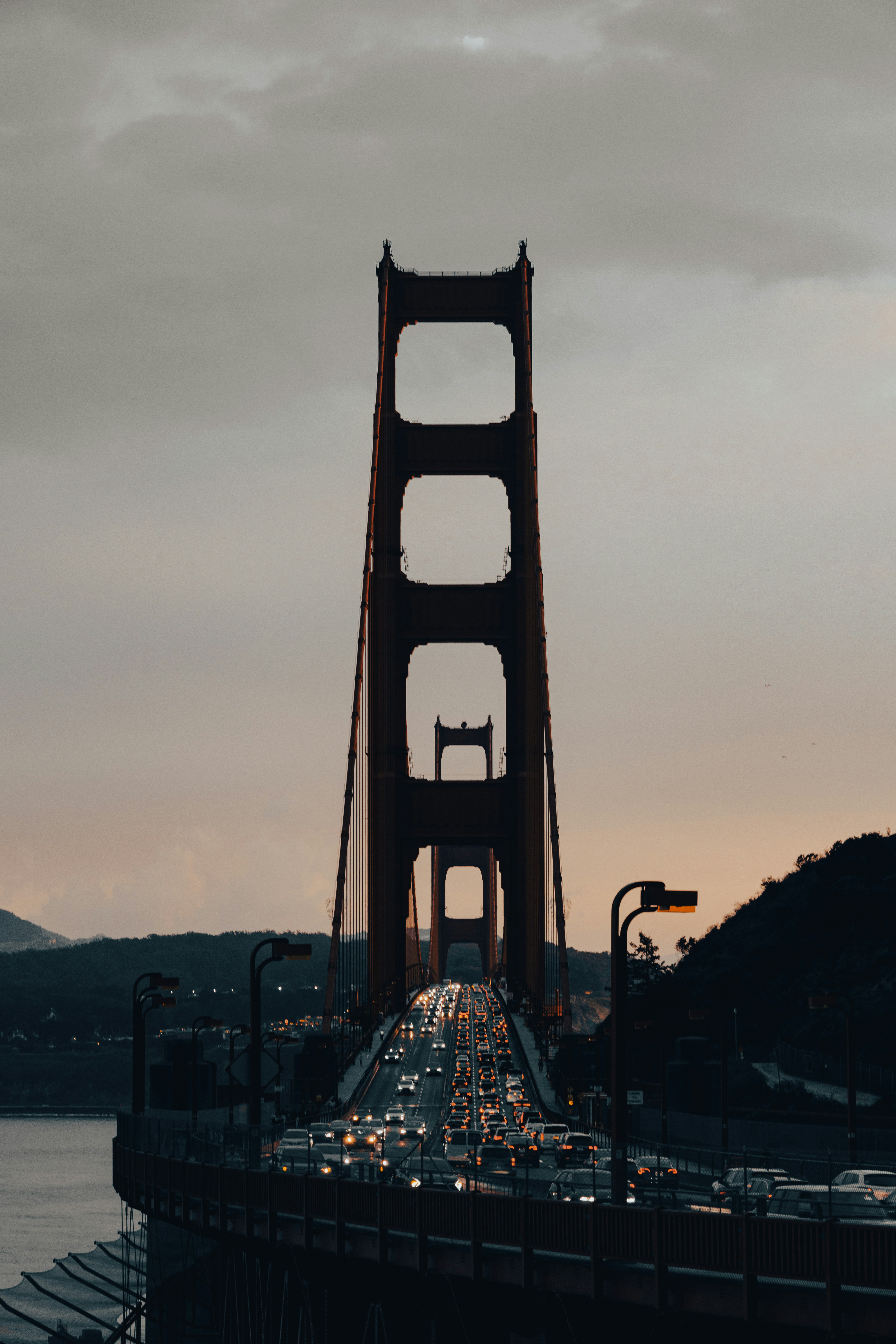 A very tall bridge over a body of water photo – Free Bridge Image on ...
