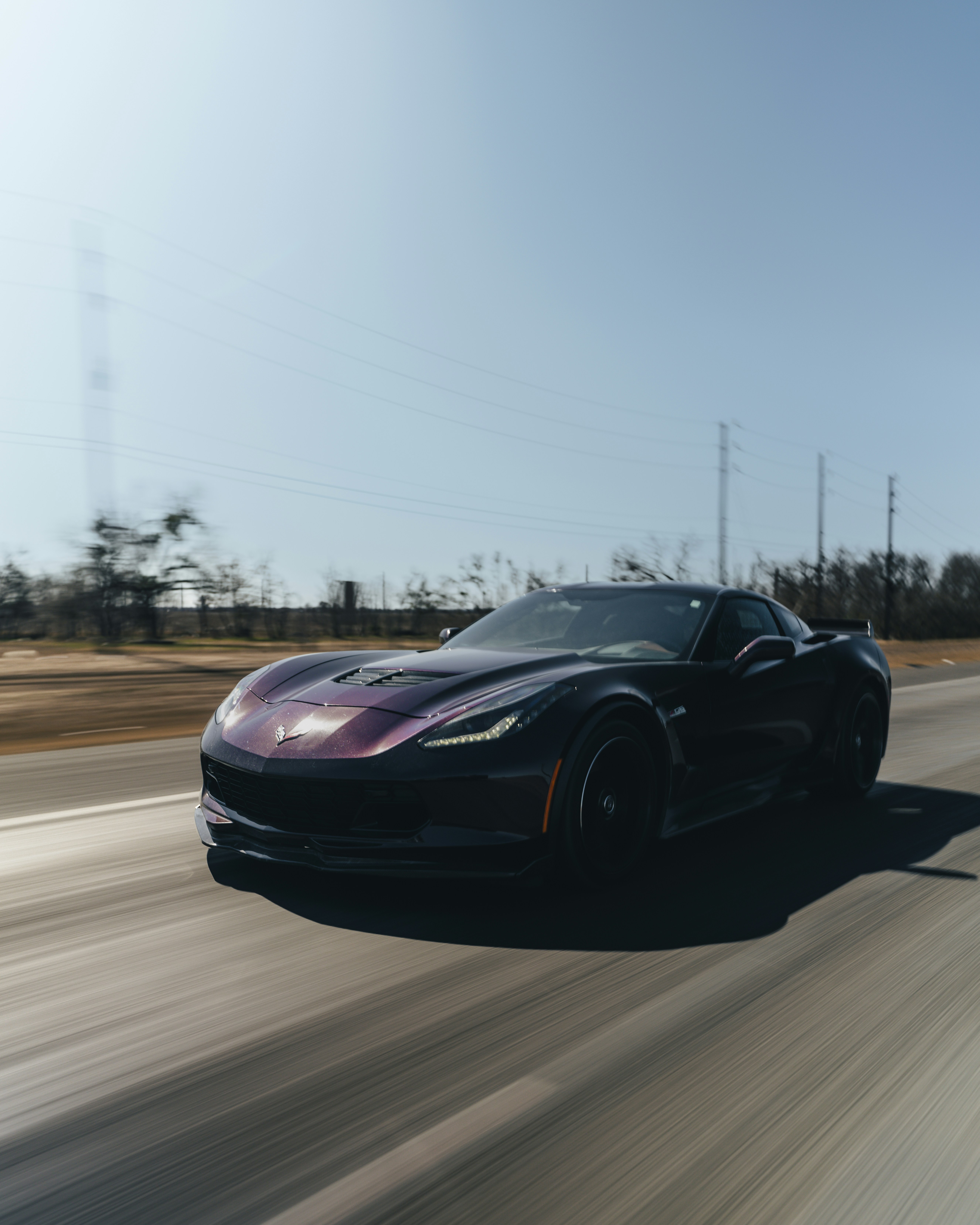 A black sports car driving down a highway photo – Free C7 z06 Image on ...