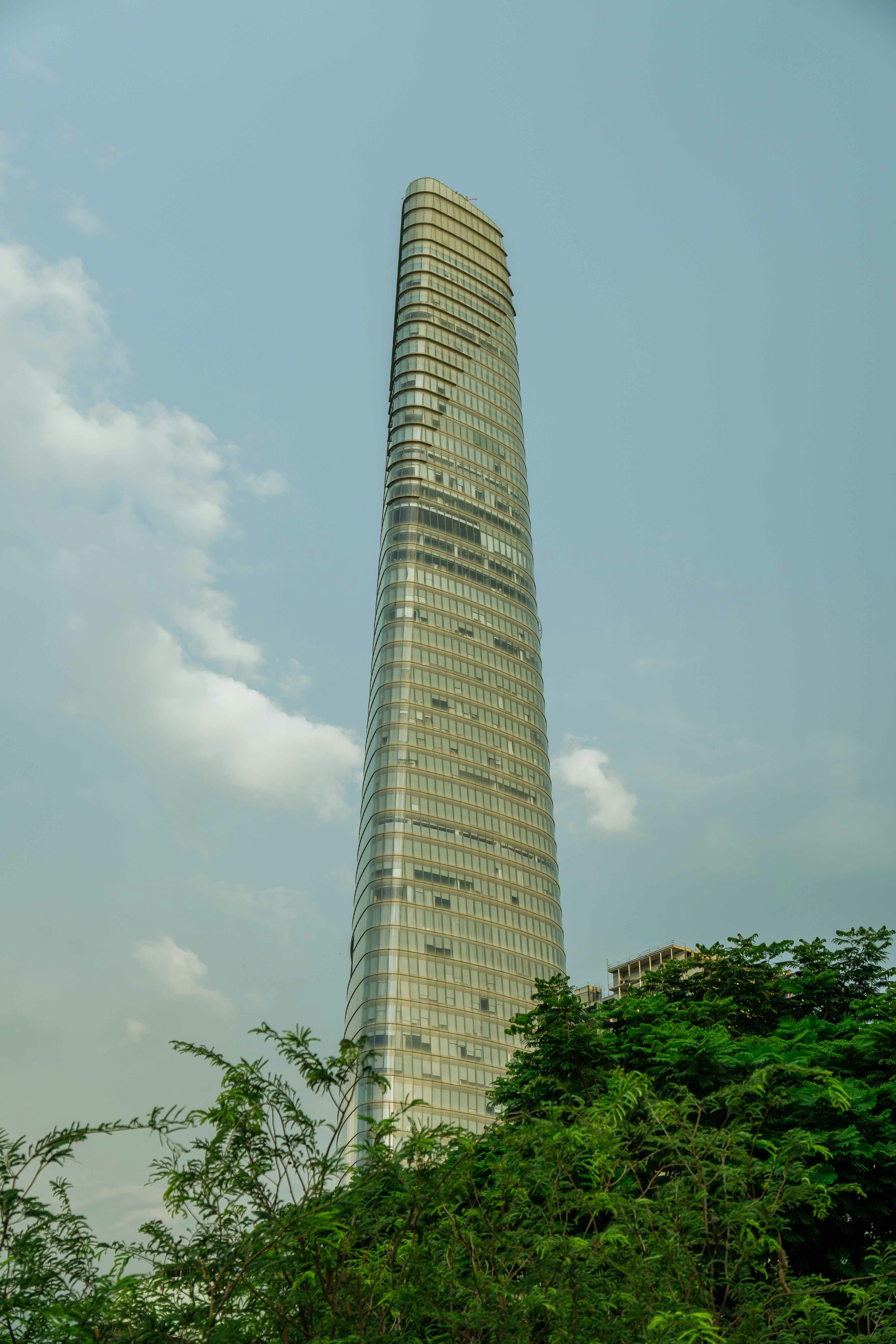 Glass Helix Rising Above the Green Canopy