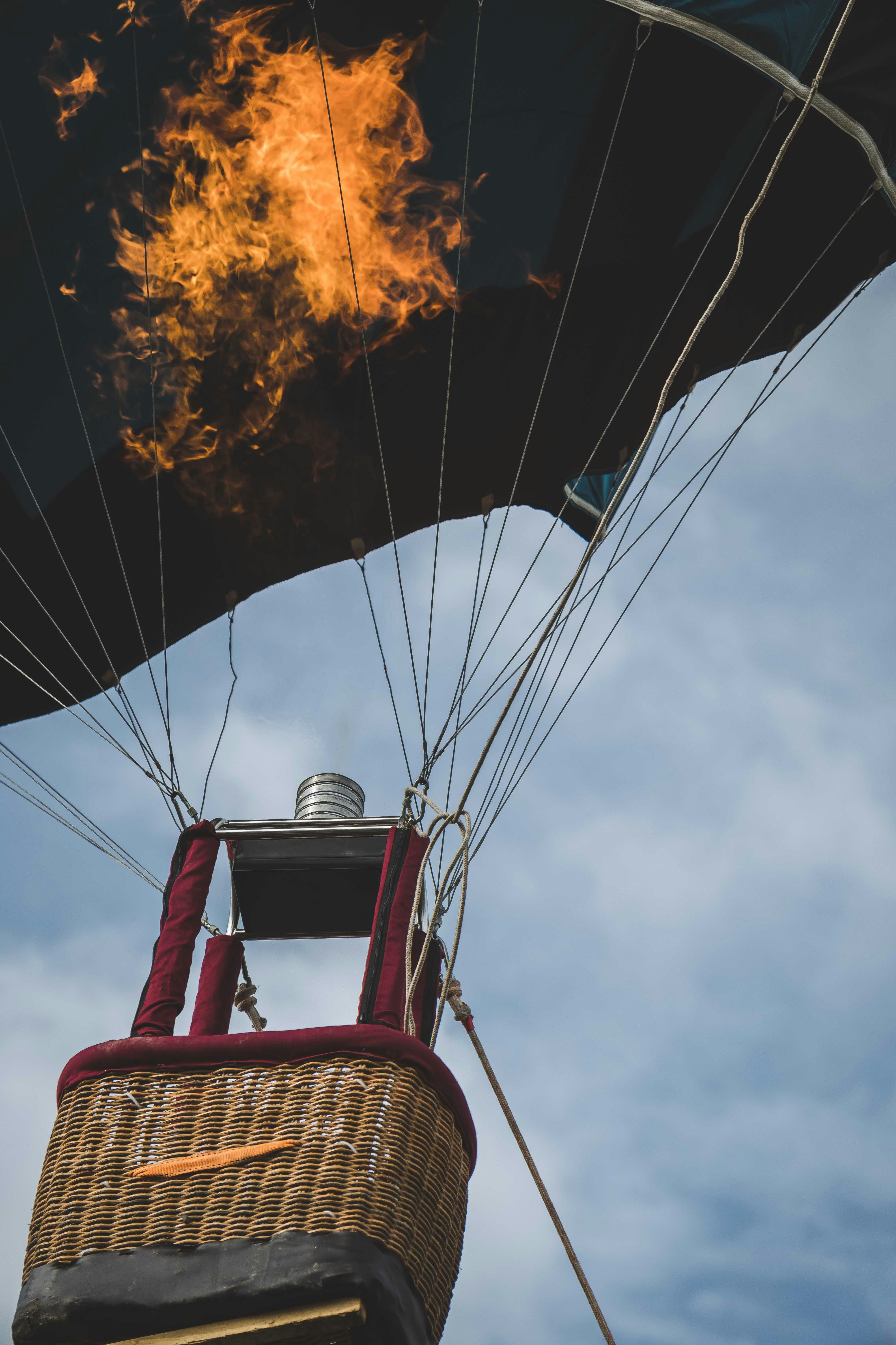 A hot air balloon with a flame coming out of it photo – Free Food Image ...