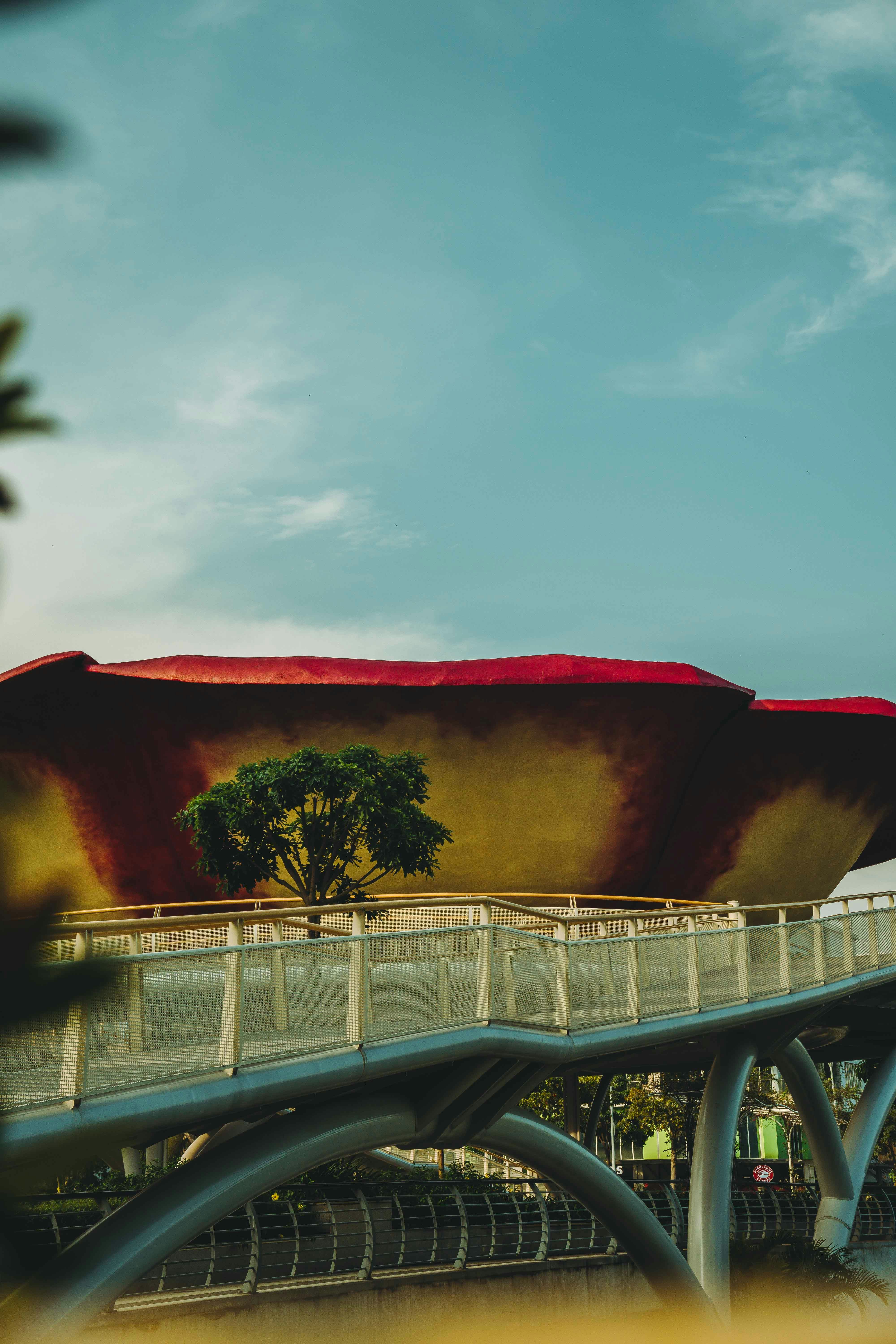 A building with a red roof on top of a bridge photo – Free Vietnam ...