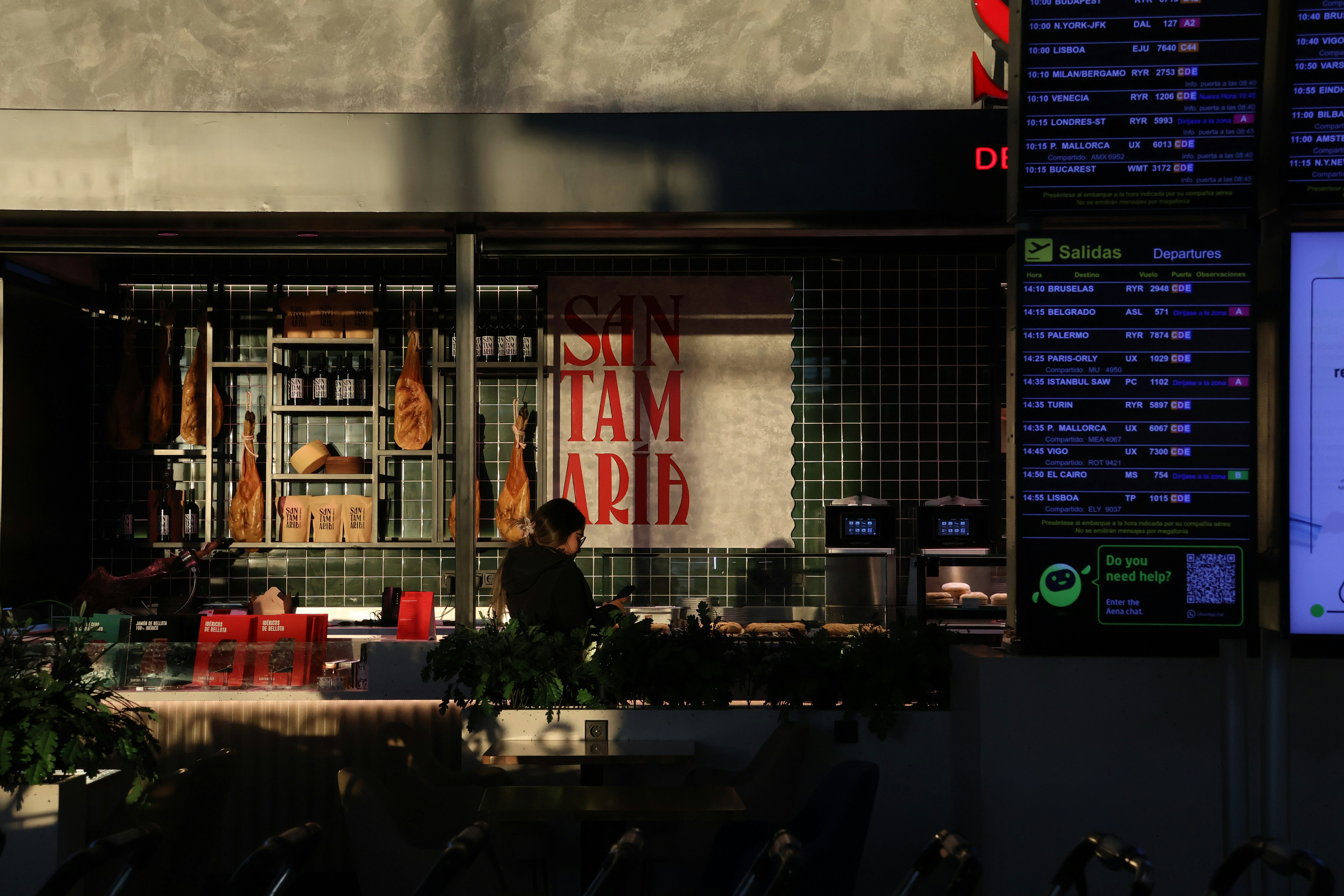 A building with a lot of signs on the side of it photo – Free Terminal ...