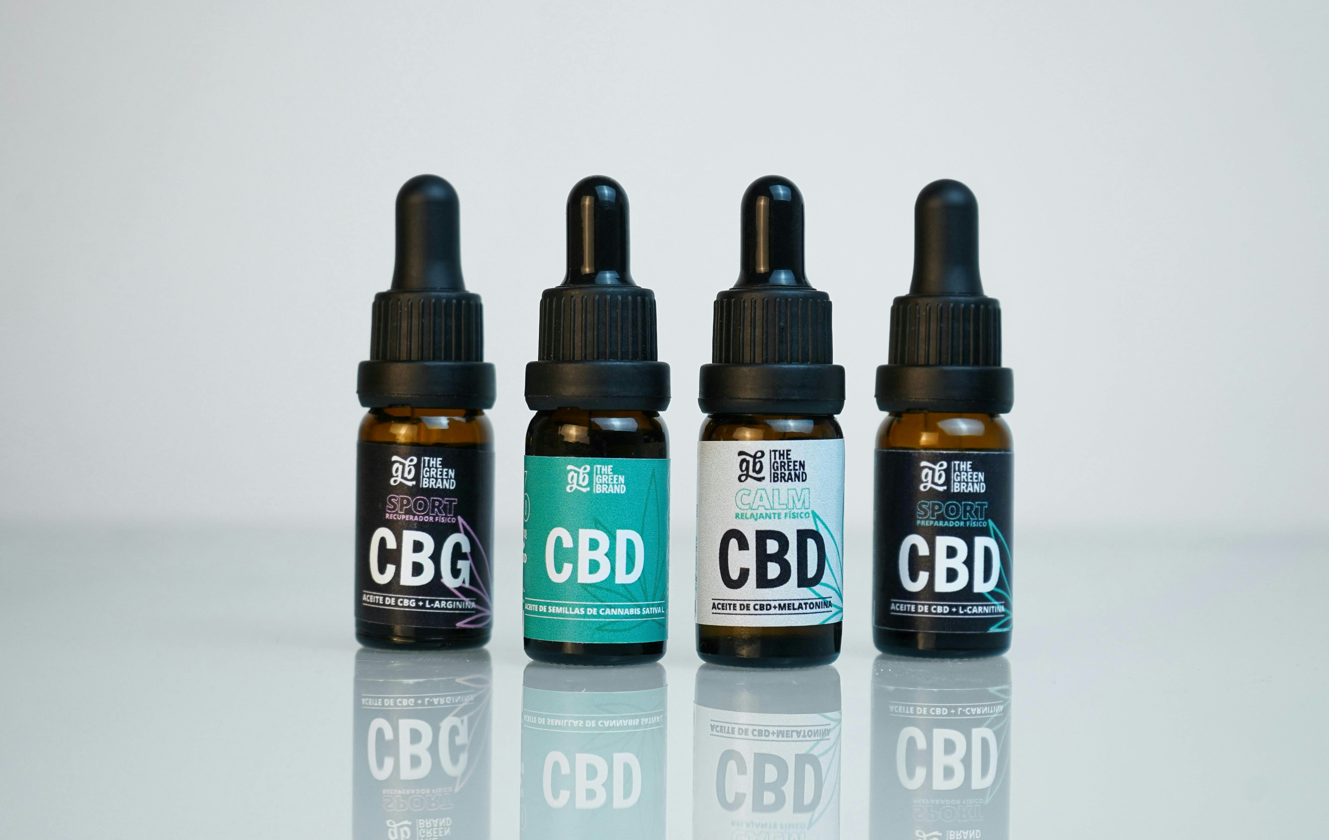 Three bottles of cbd sitting next to each other photo – Free Aceite de ...