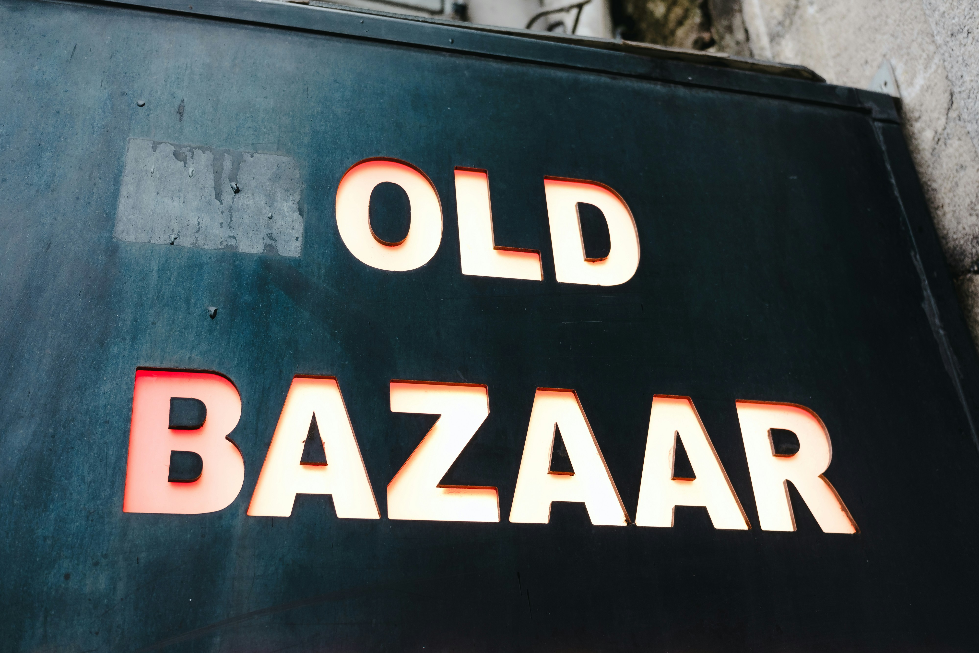 A sign that says old bazzar on the side of a building photo – Free ...