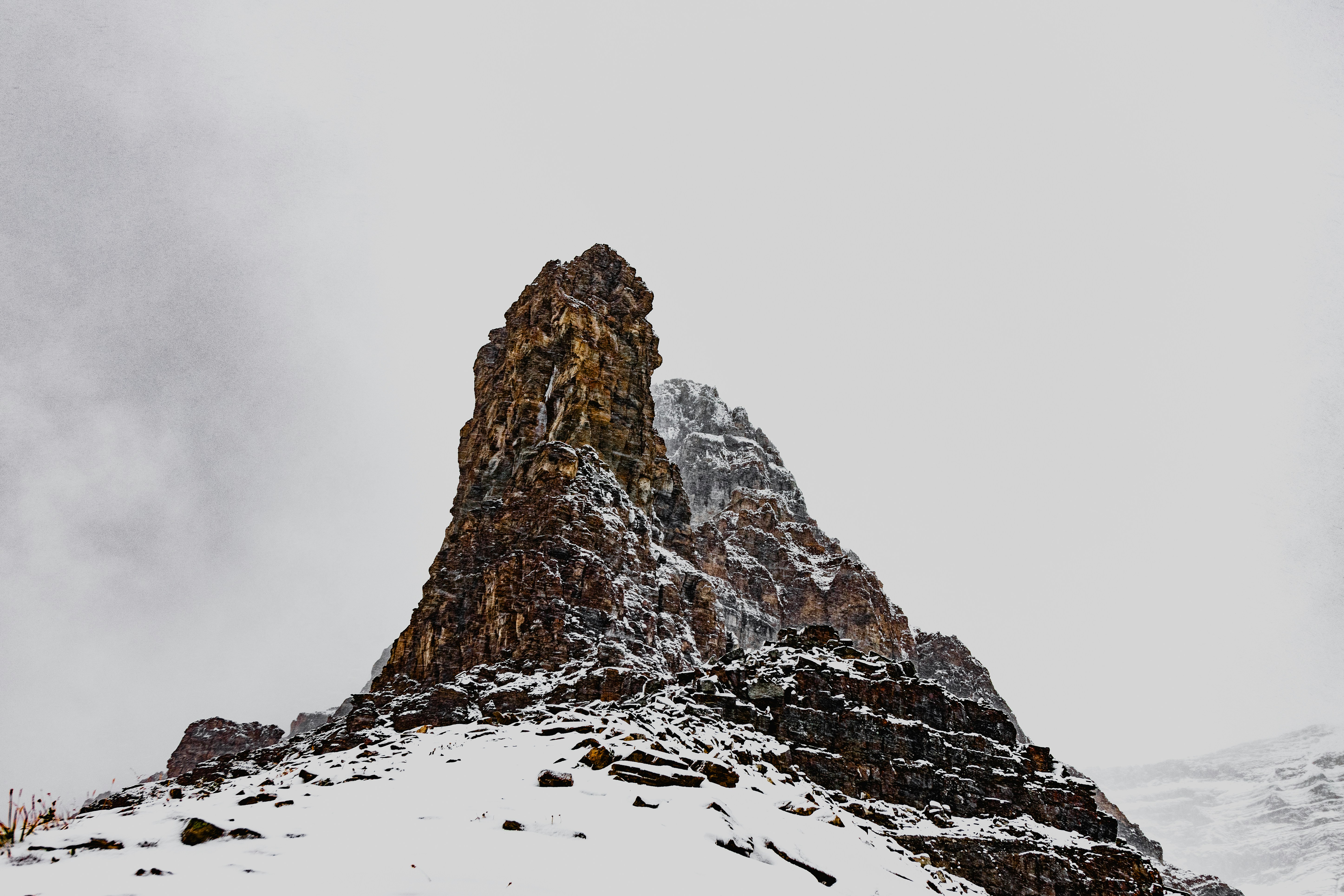 A snow covered mountain with a sky background
