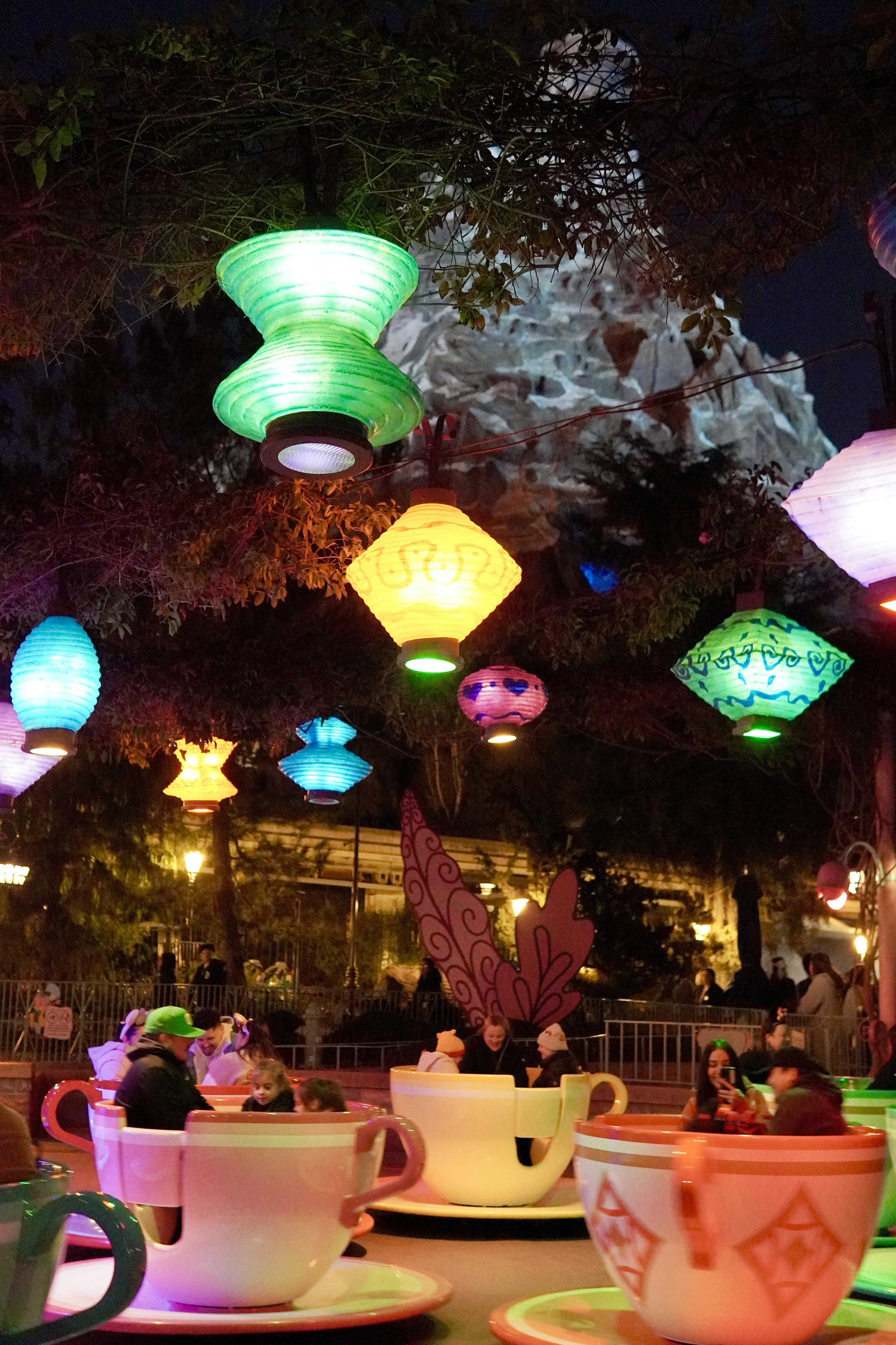 Neon Lantern Garden Over a Teacup Carousel