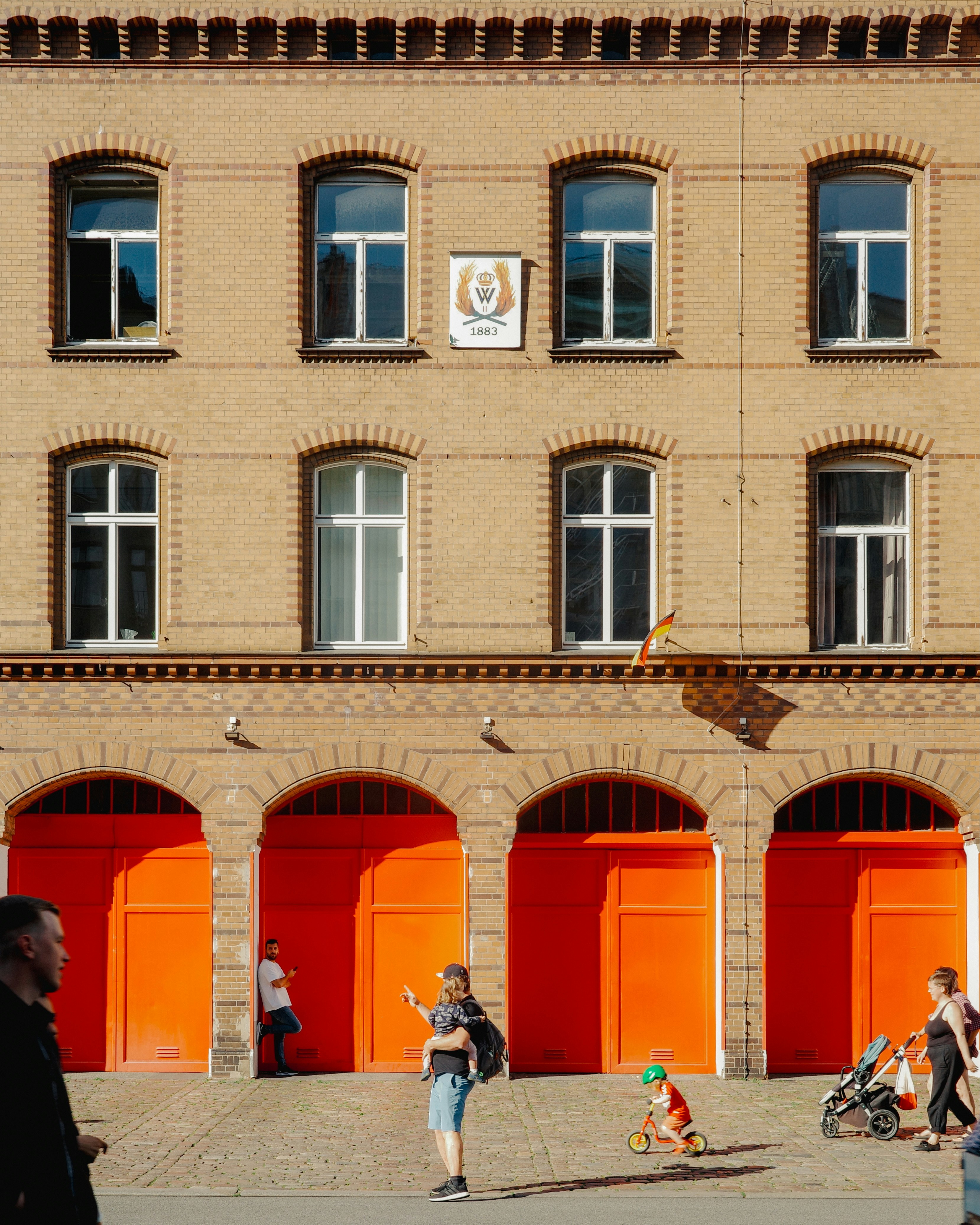 folks | A group of people walking in front of a building