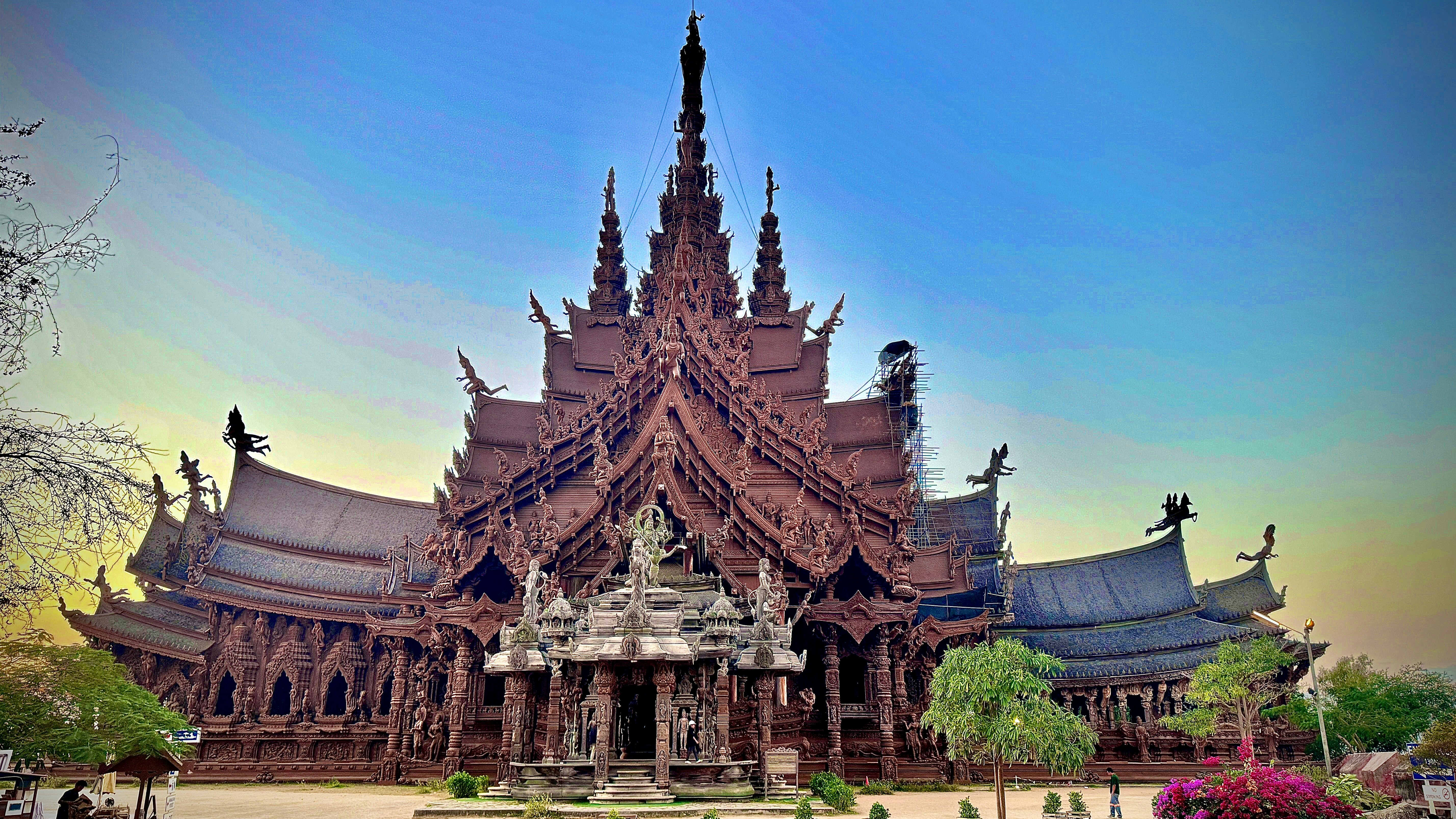 Ornate Wooden Temple Reaching Toward a Golden Sky