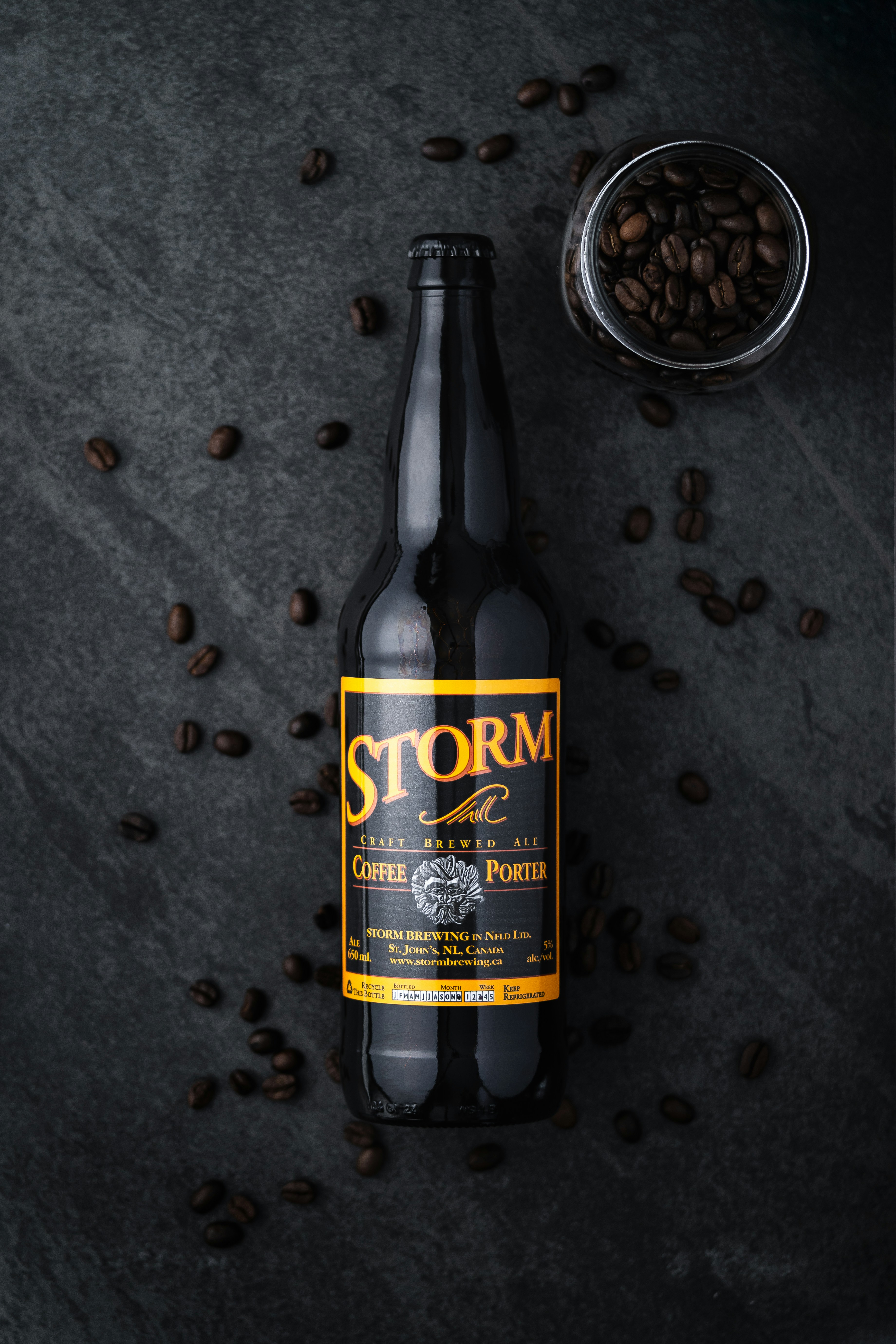 A bottle of beer next to some coffee beans photo – Free Alcohol Image ...