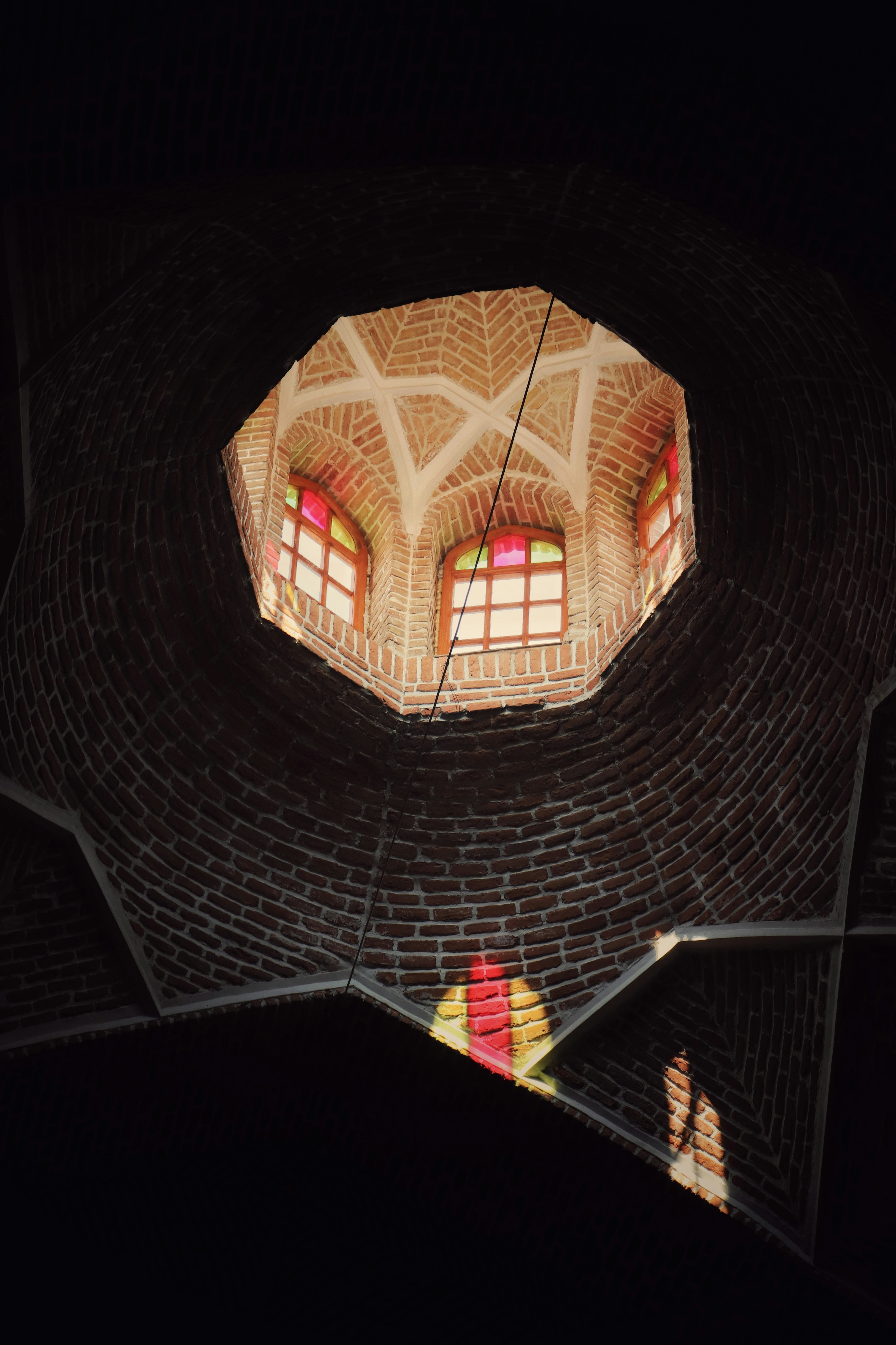 Crown of Bricks: An Octagonal Skylight Framed by Stained Glass
