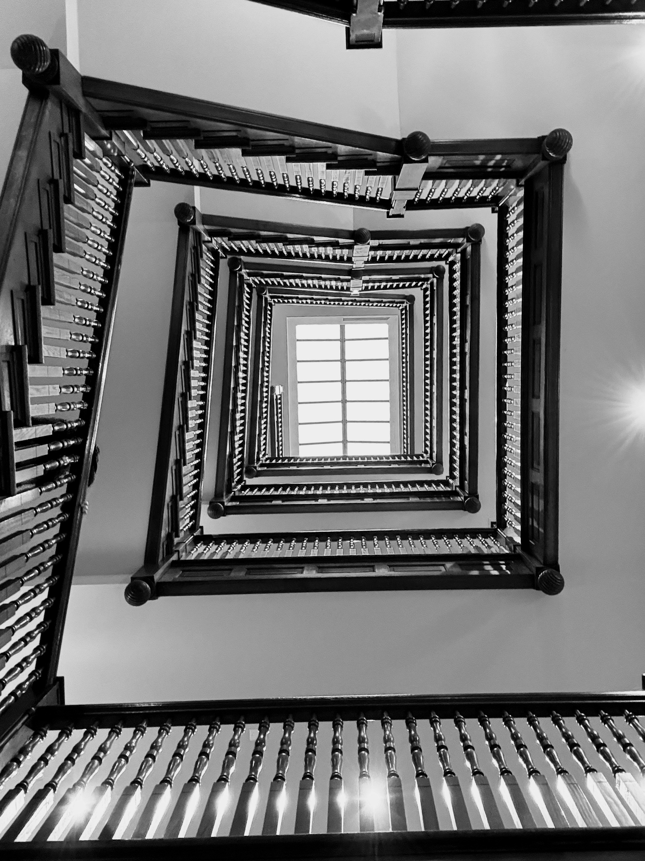 Staircase | A black and white photo of a spiral staircase