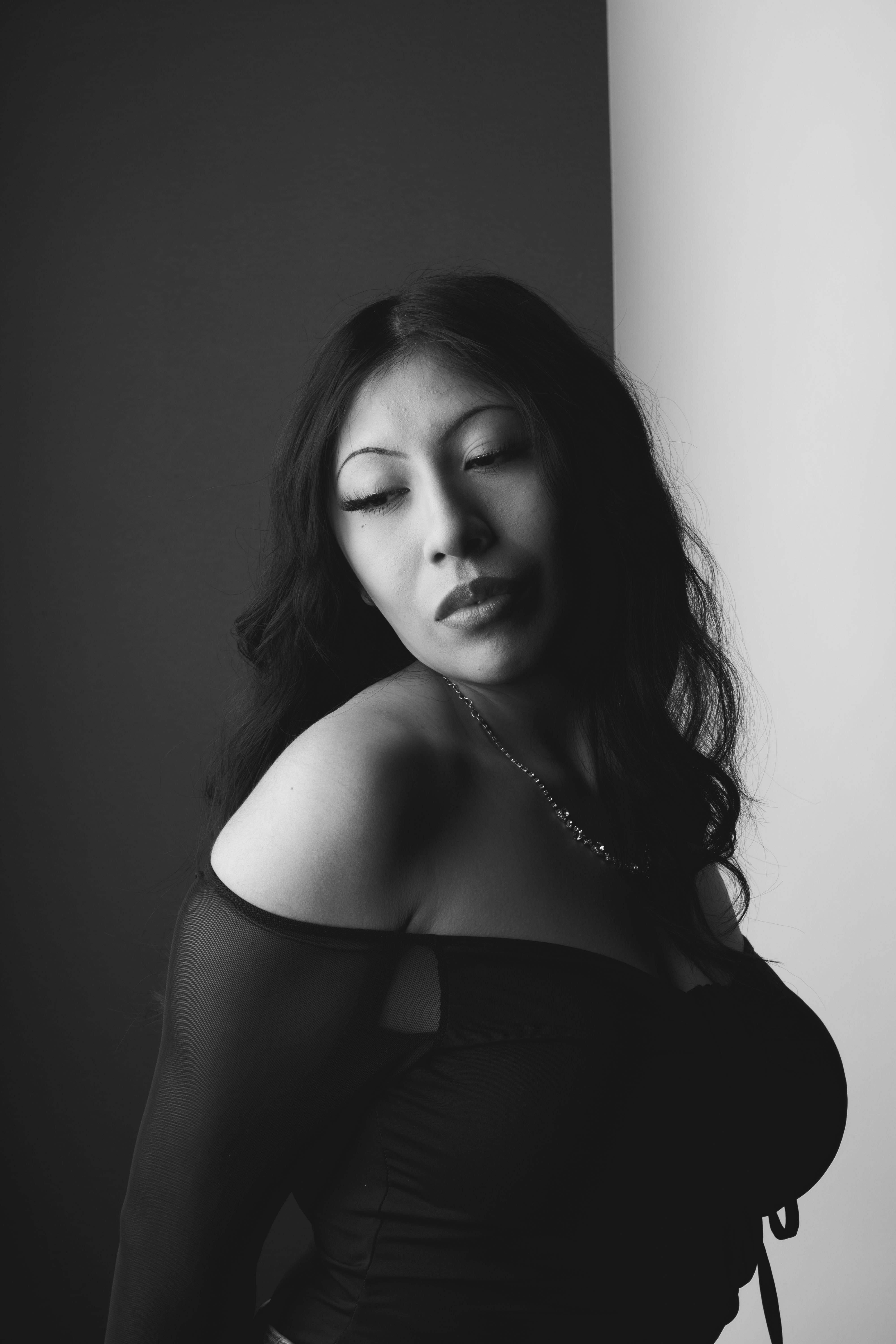 A black and white photo of a woman with her eyes closed photo – Free ...