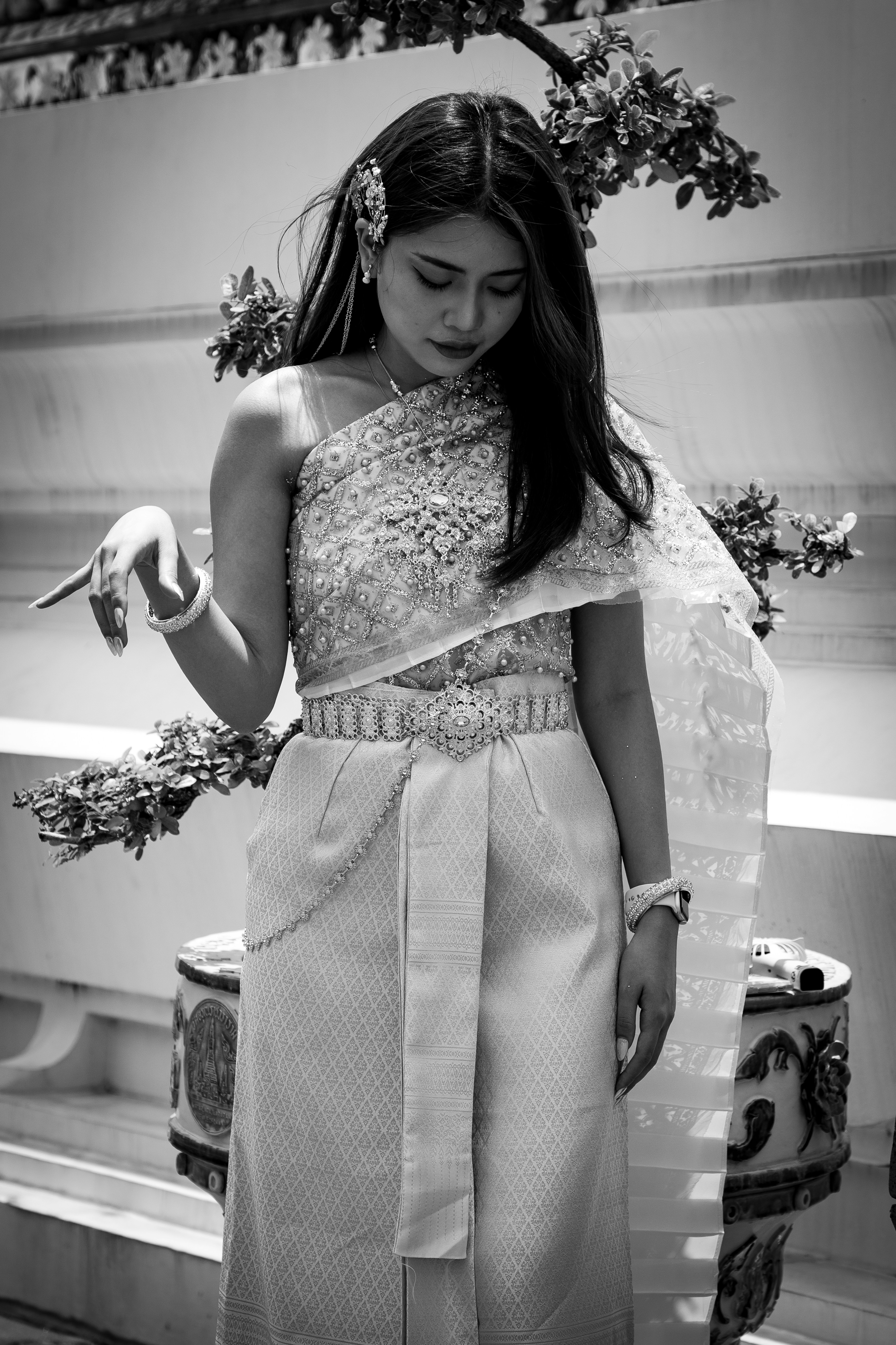 A woman in a wedding dress holding a knife