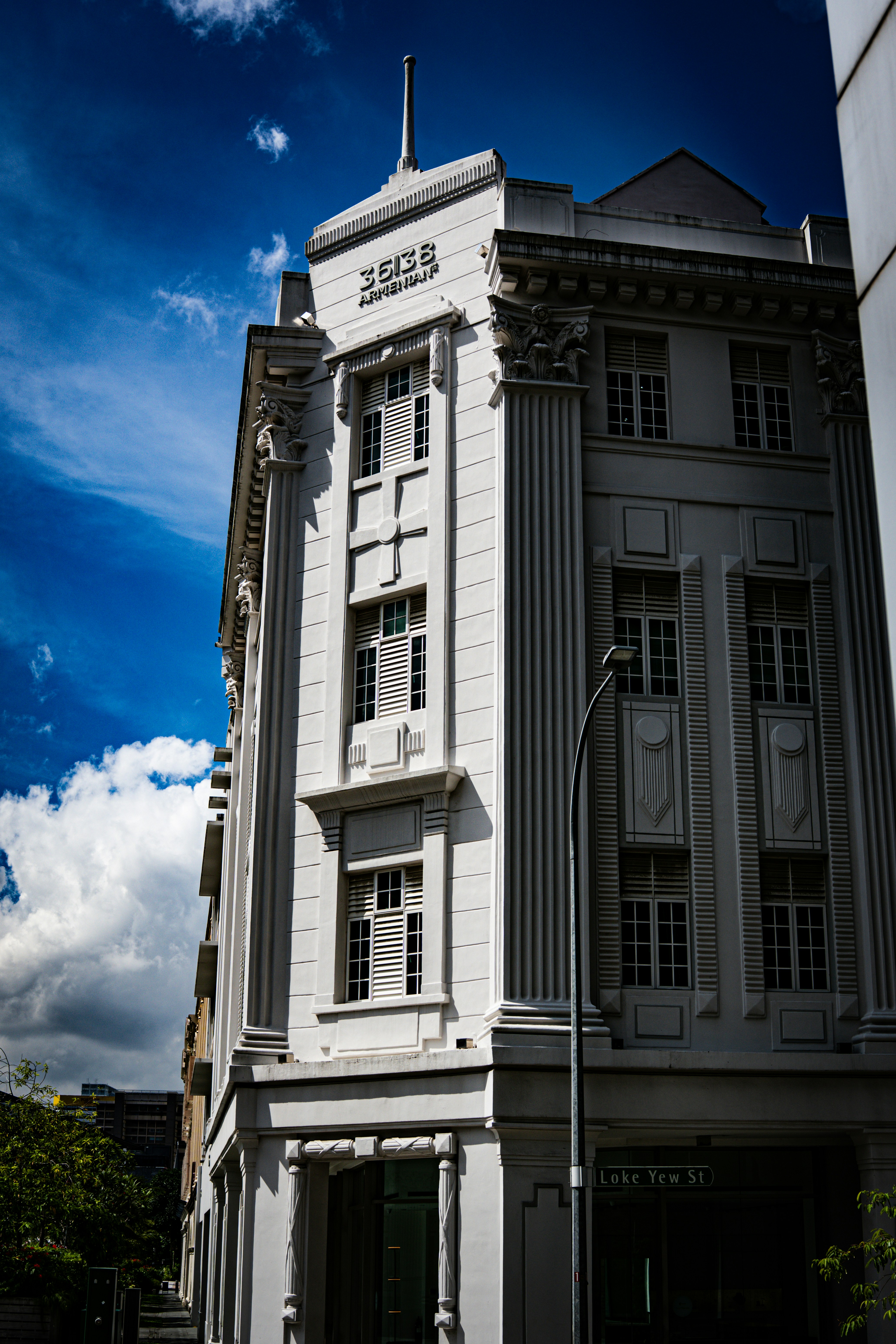Neoclassical Corner Facade Basked in Azure Daylight