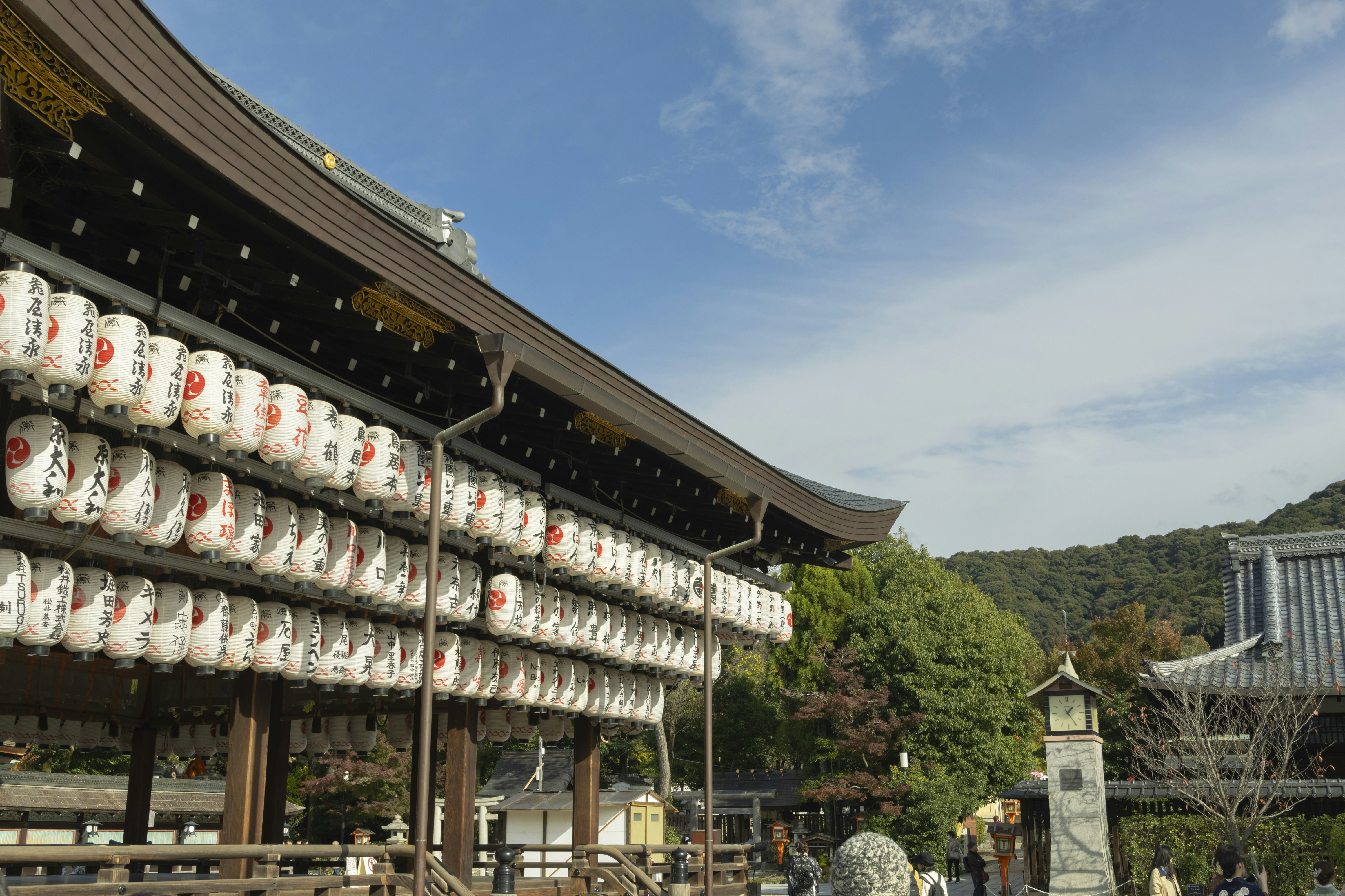 Lantern Corridor: Lighted Rows Framing a Shrine Courtyard