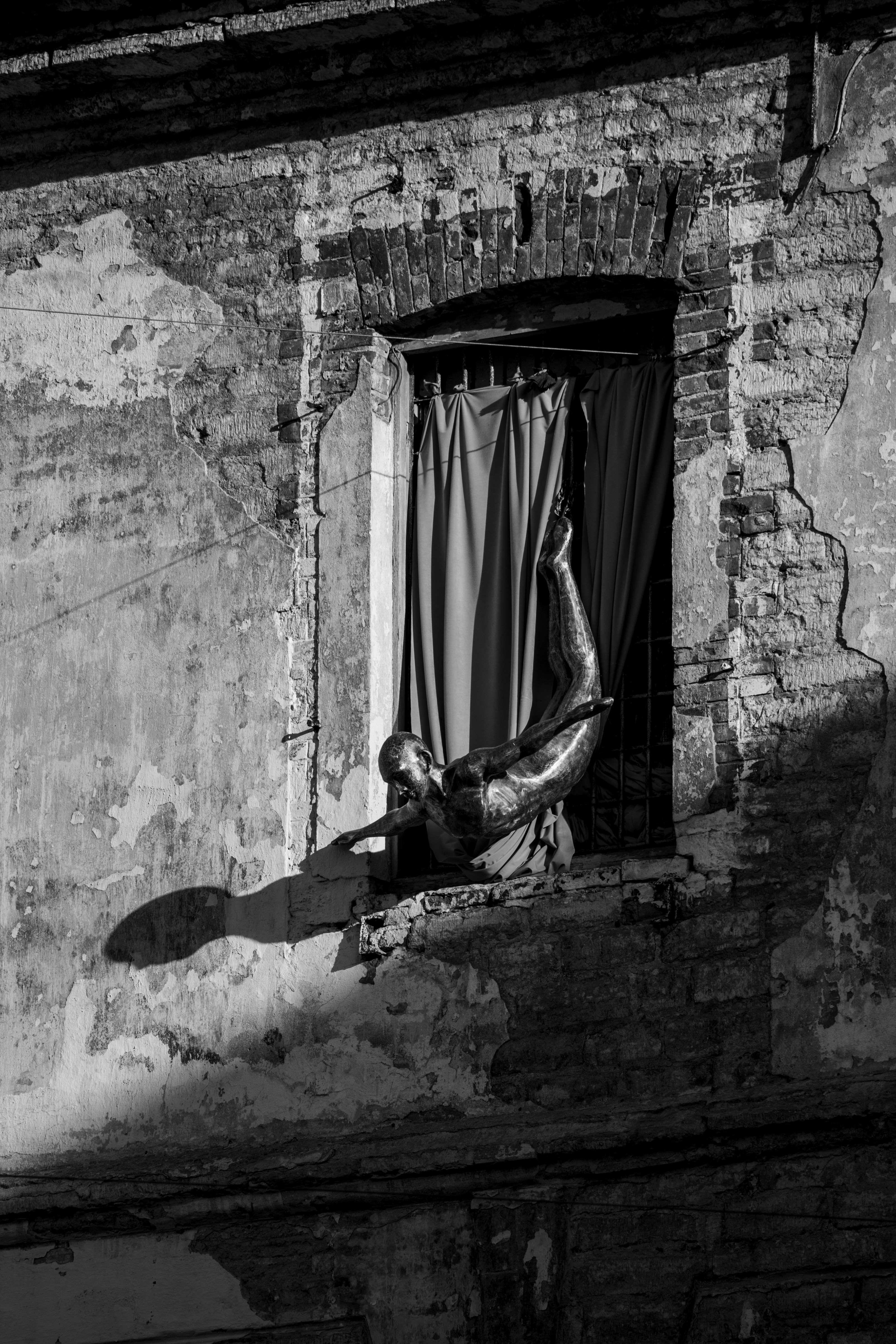 A person is looking out of a window