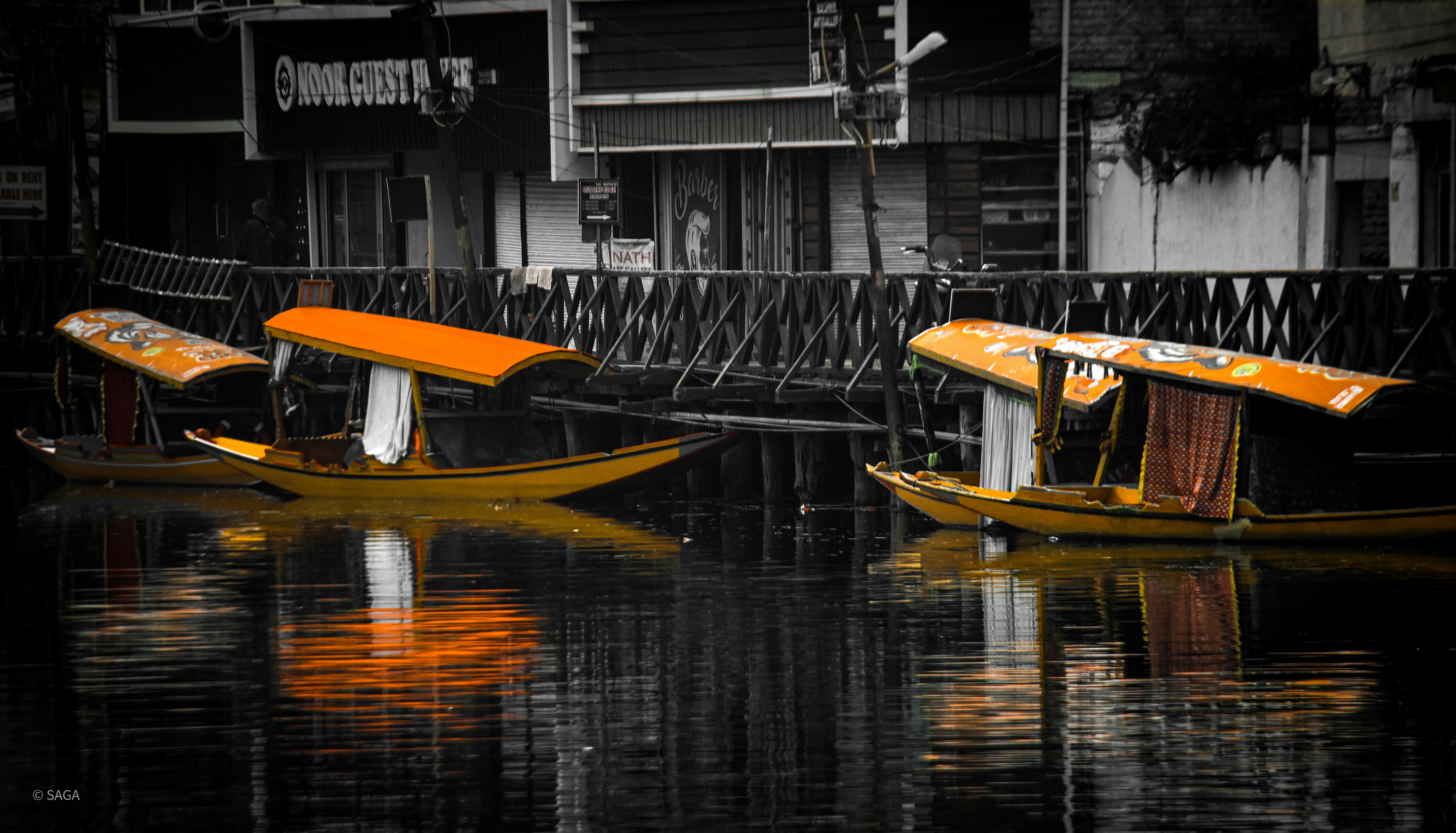 Reflections of Serenity: Boats Resting on Tranquil Waters