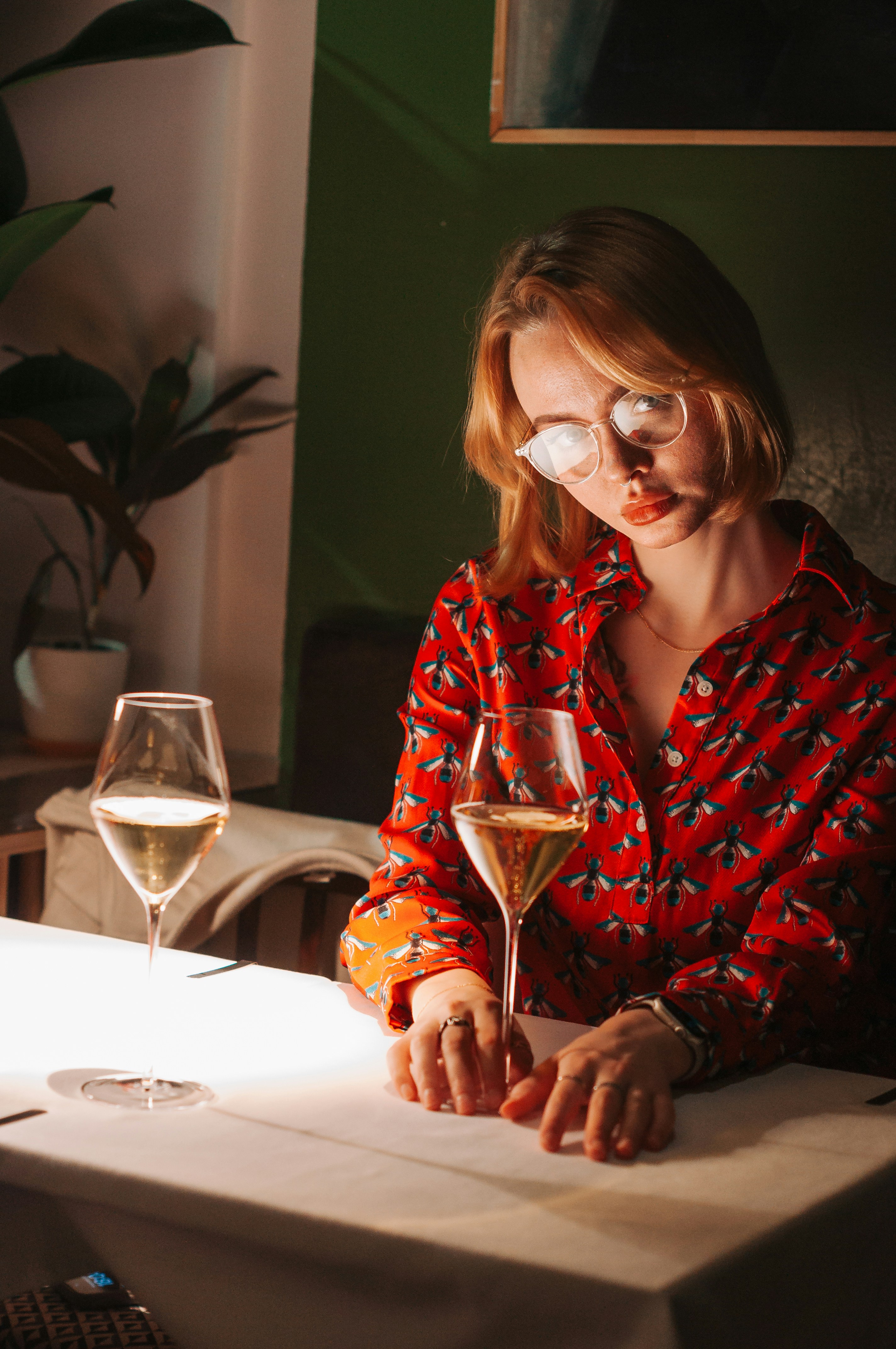 Crimson Florals, Soft Glow: A Quiet Table Portrait