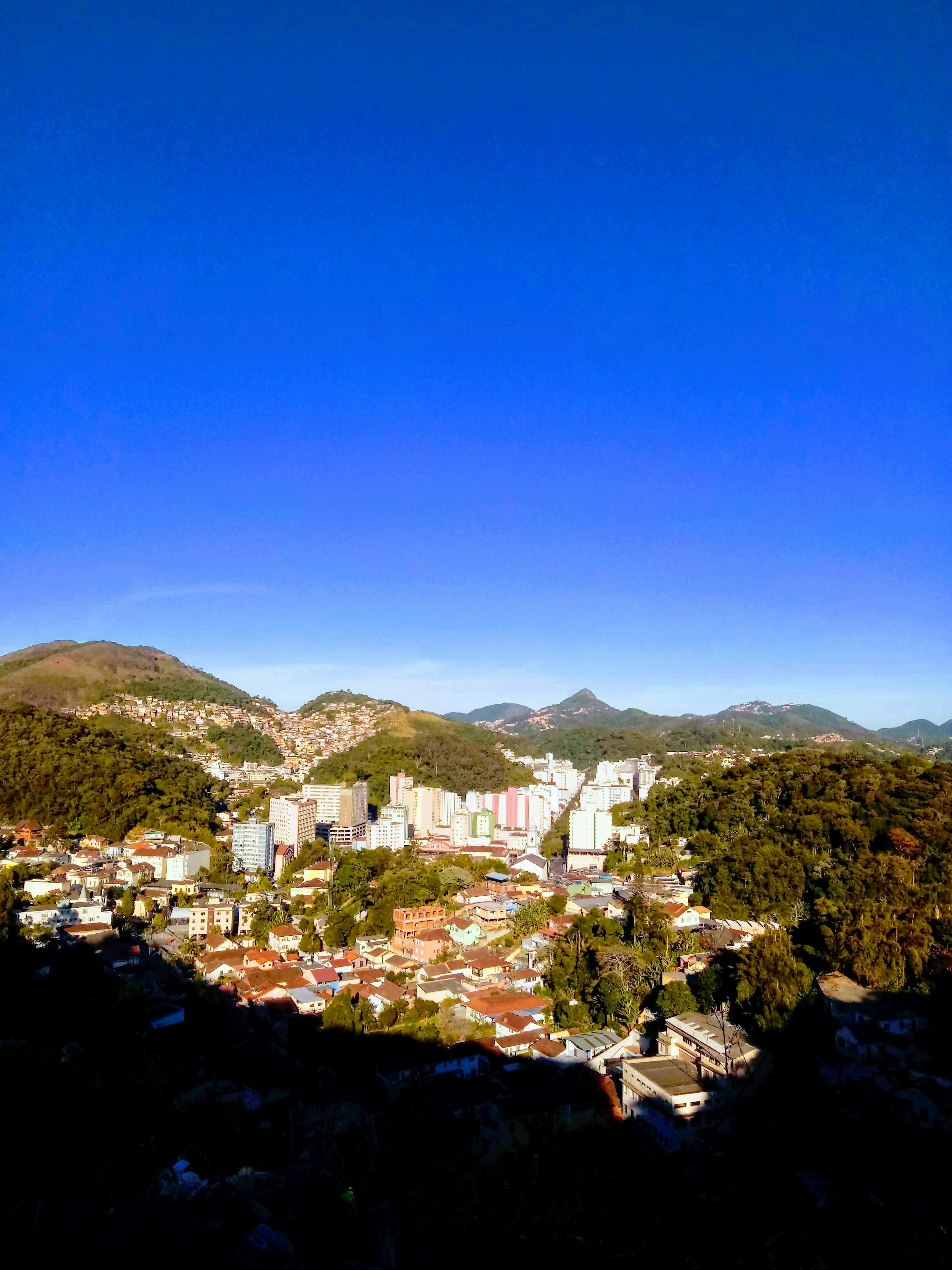 Serene Urban Valley Under Clear Skies