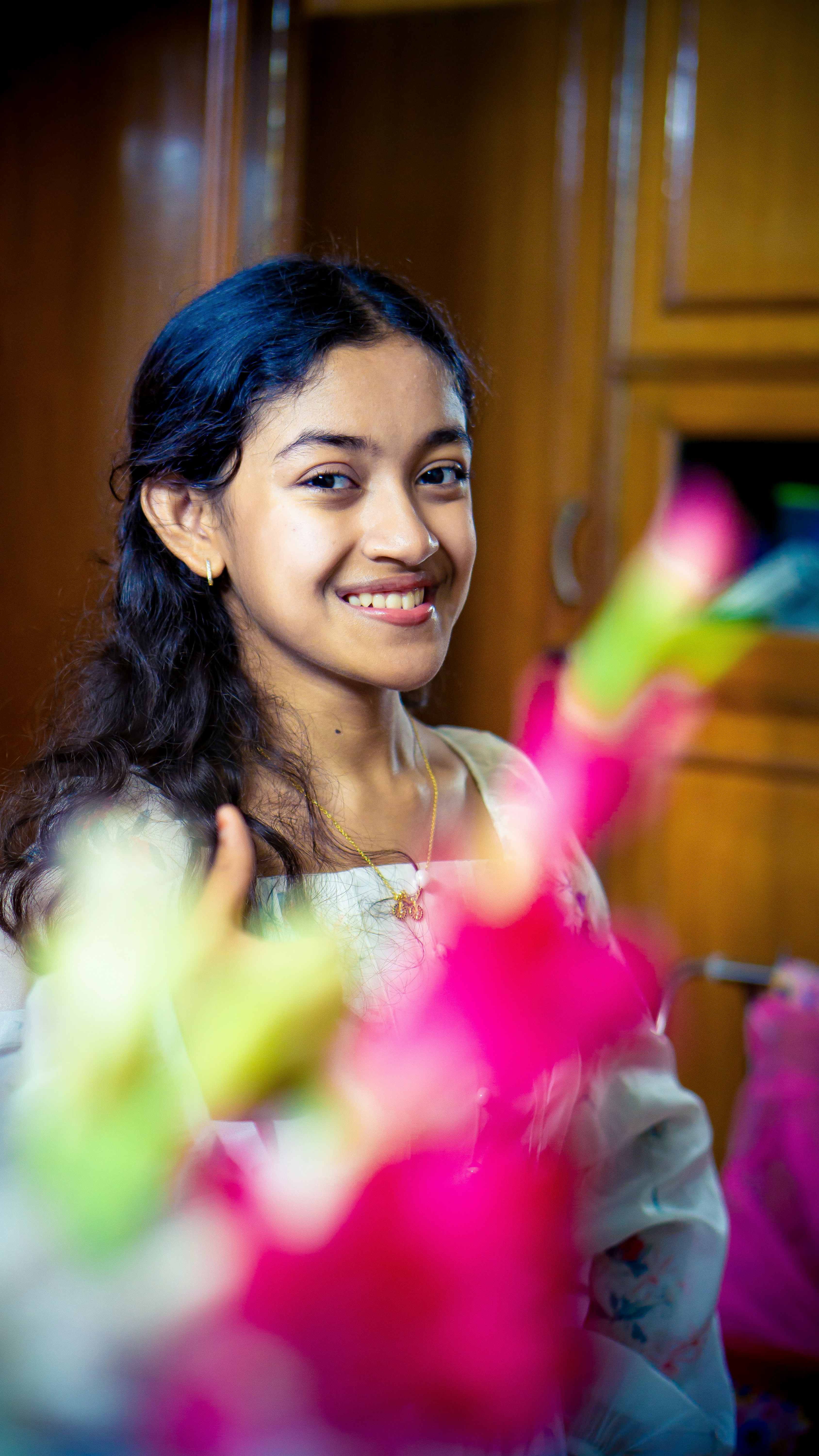 Joyful Glance Amidst Vibrant Blooms