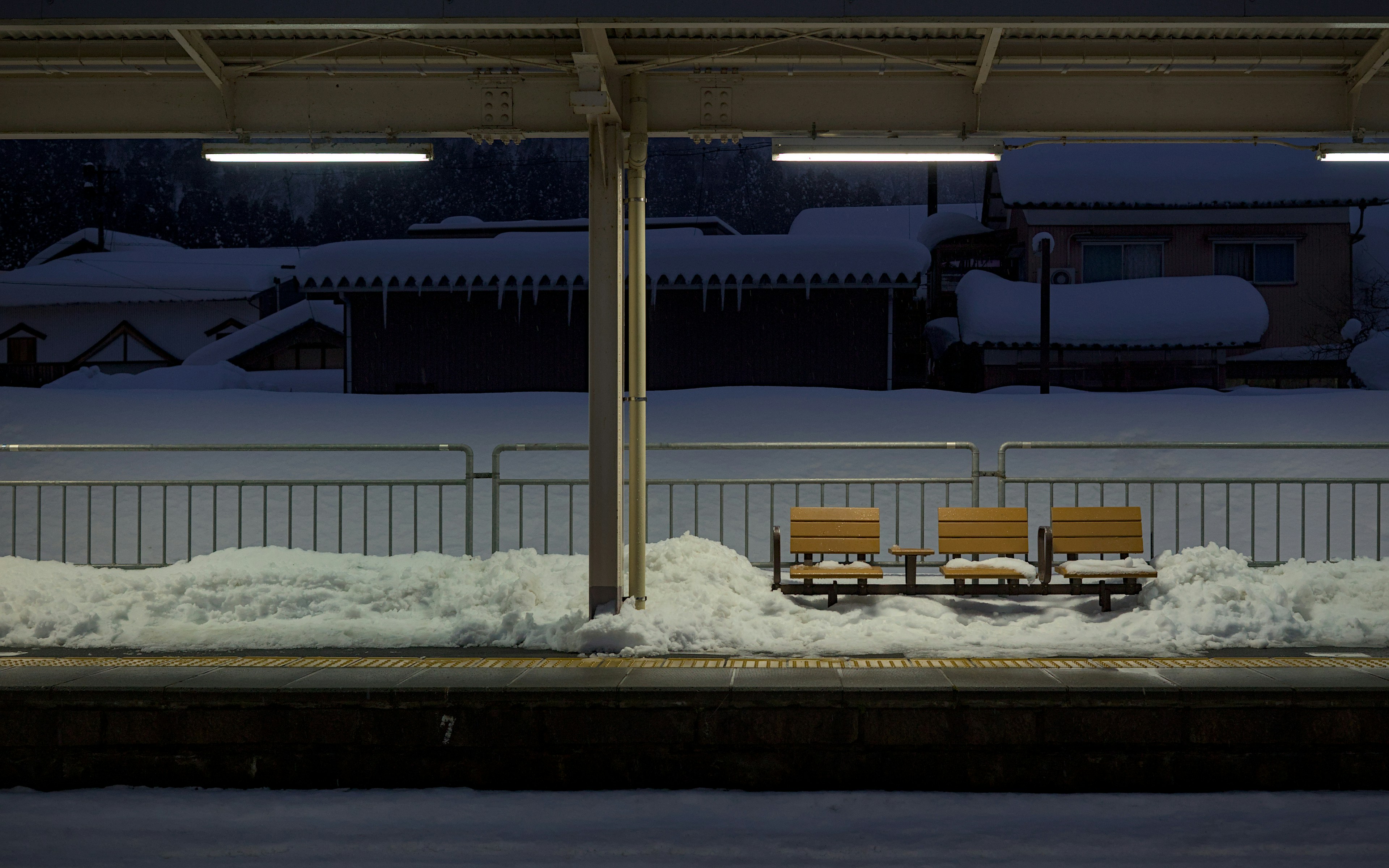 A train station covered in snow at night photo – Free Japan Image on ...