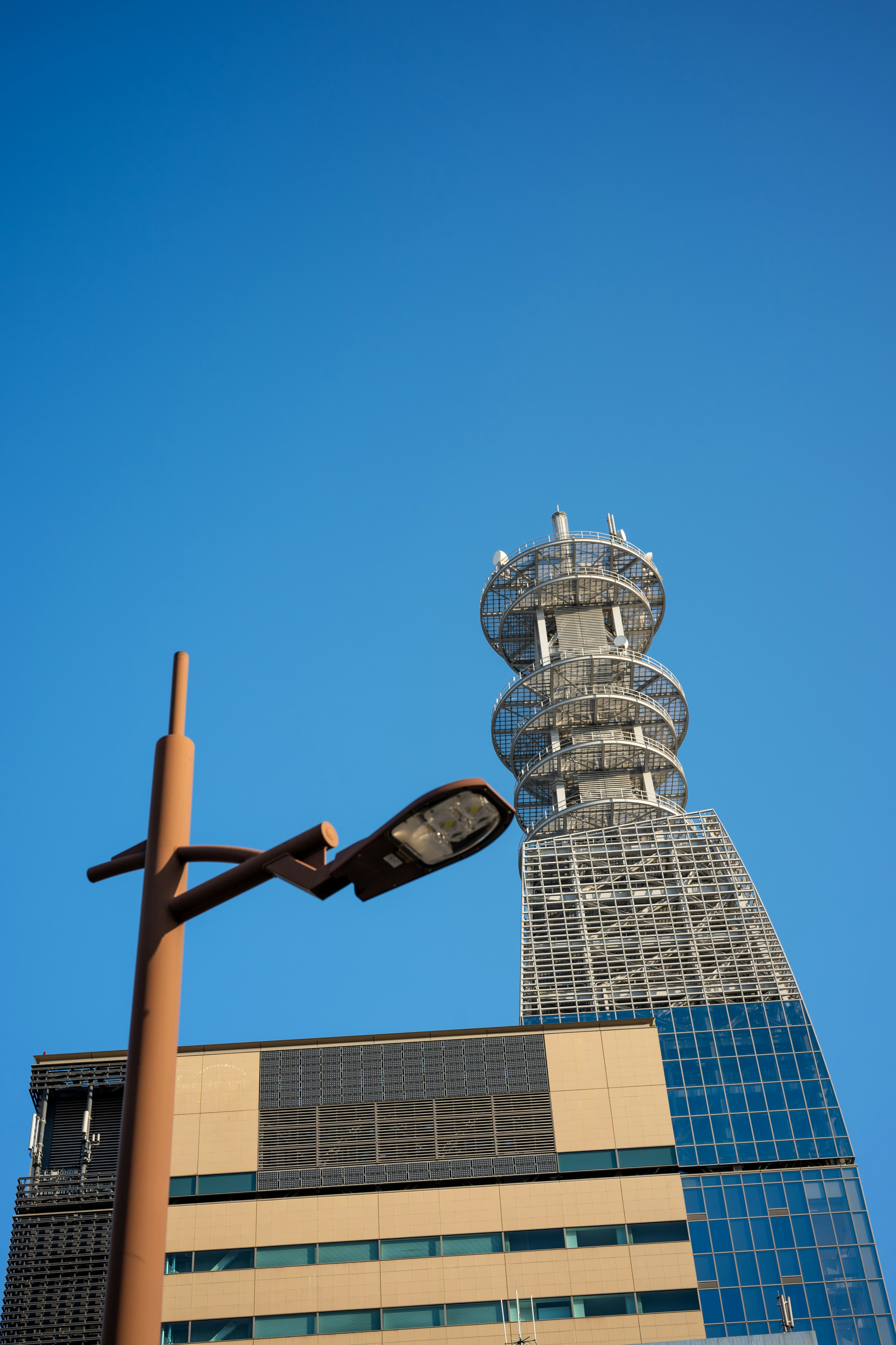 A very tall building with a very tall tower in the background photo ...