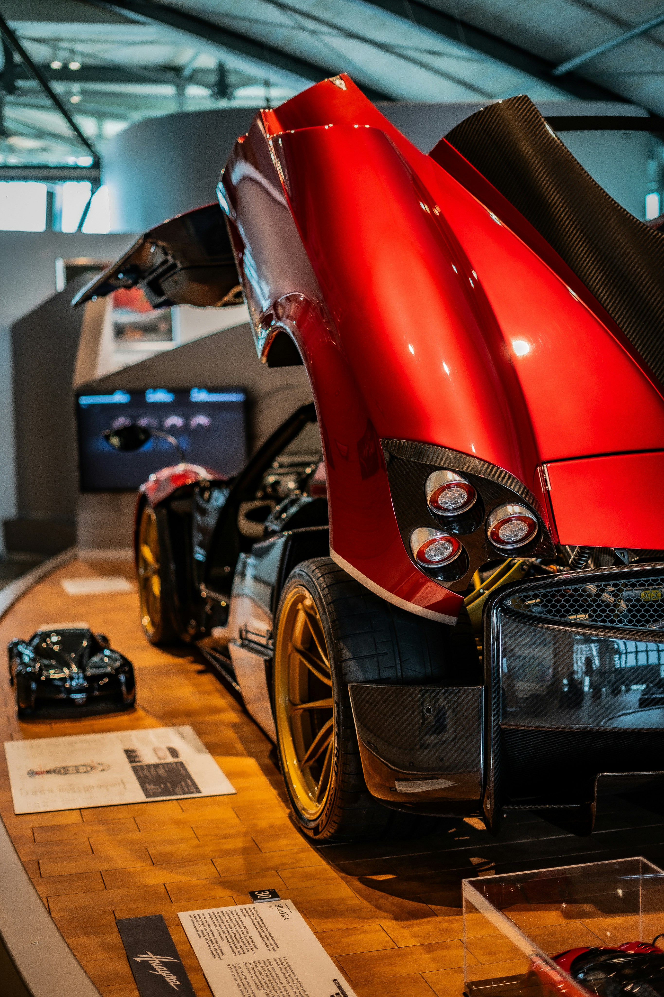 A red sports car on display at a car show photo – Free Car Image on ...